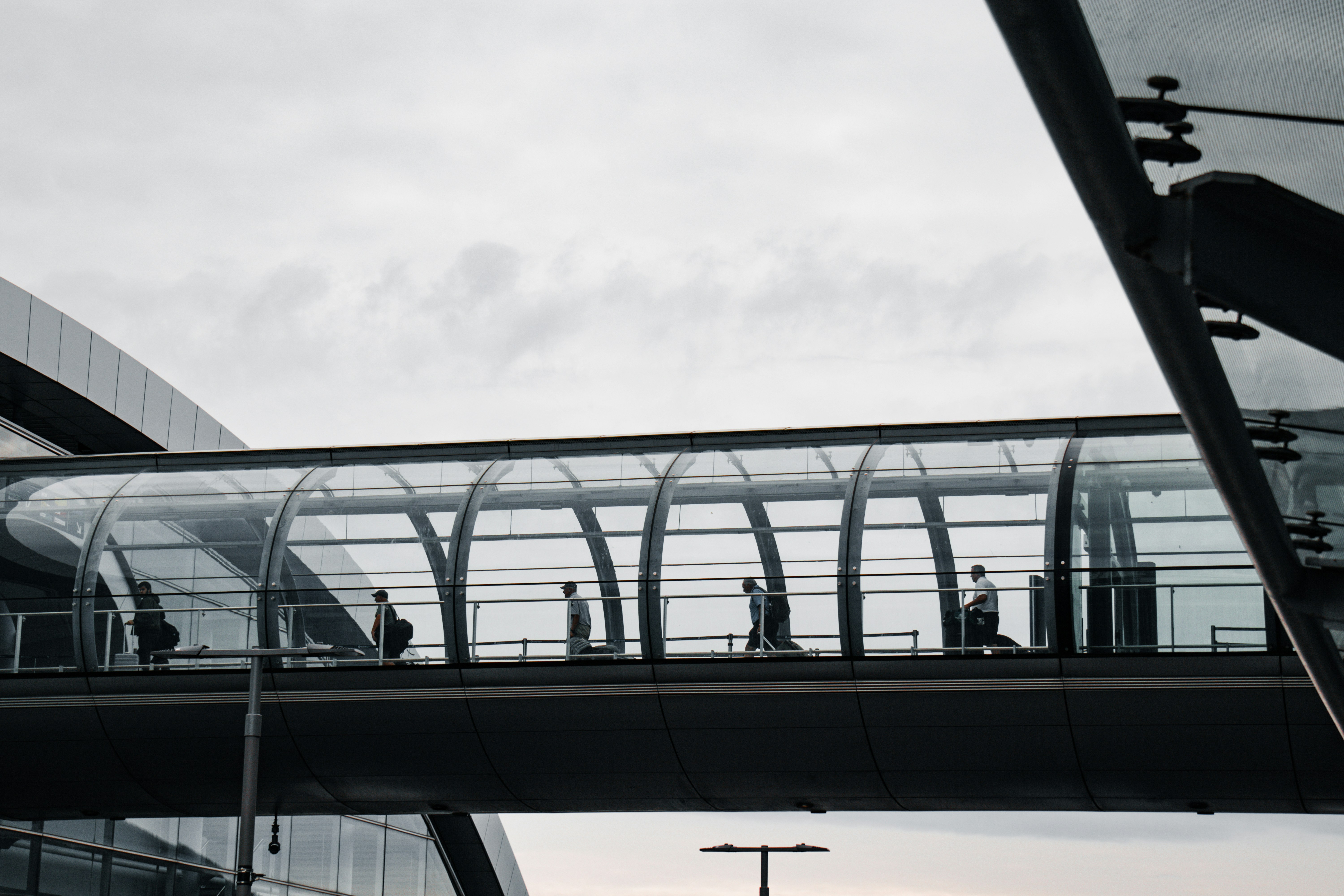 A group of people walking on a bridge photo – Free Building Image on ...