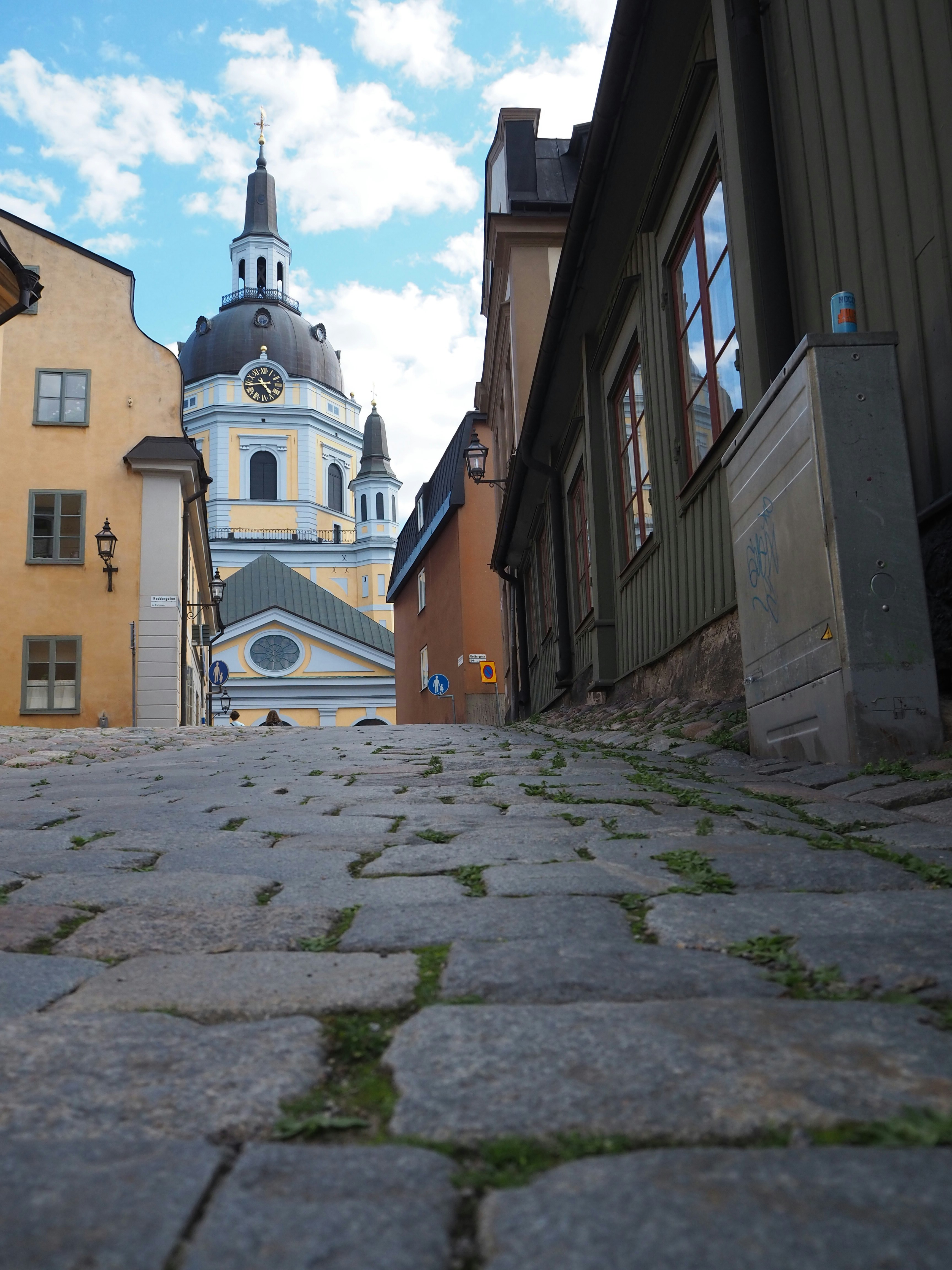 Cobblestone Path Toward a Baroque Clocktower