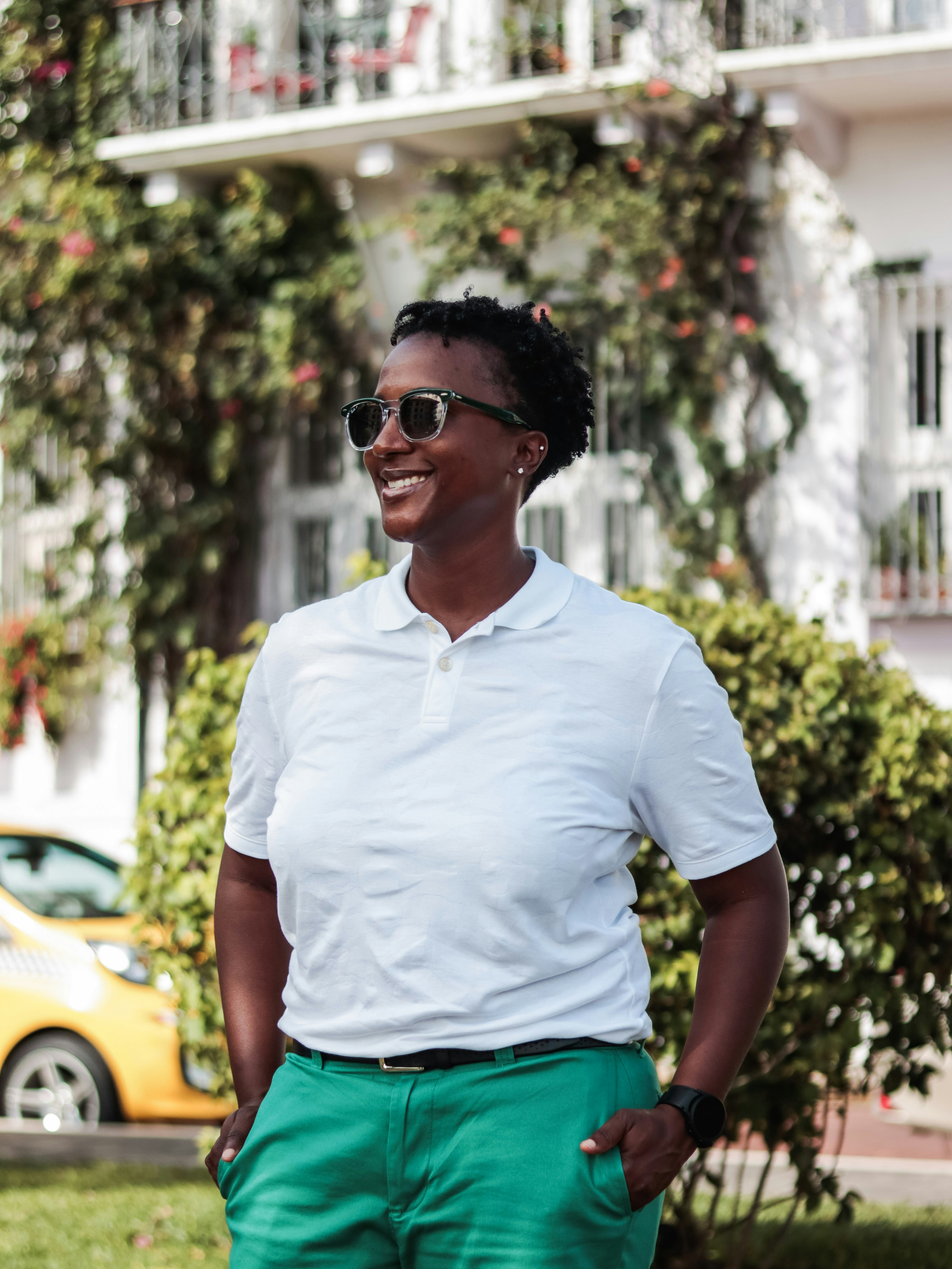 Sunlit Confidence: A Portrait on a Verdant Street