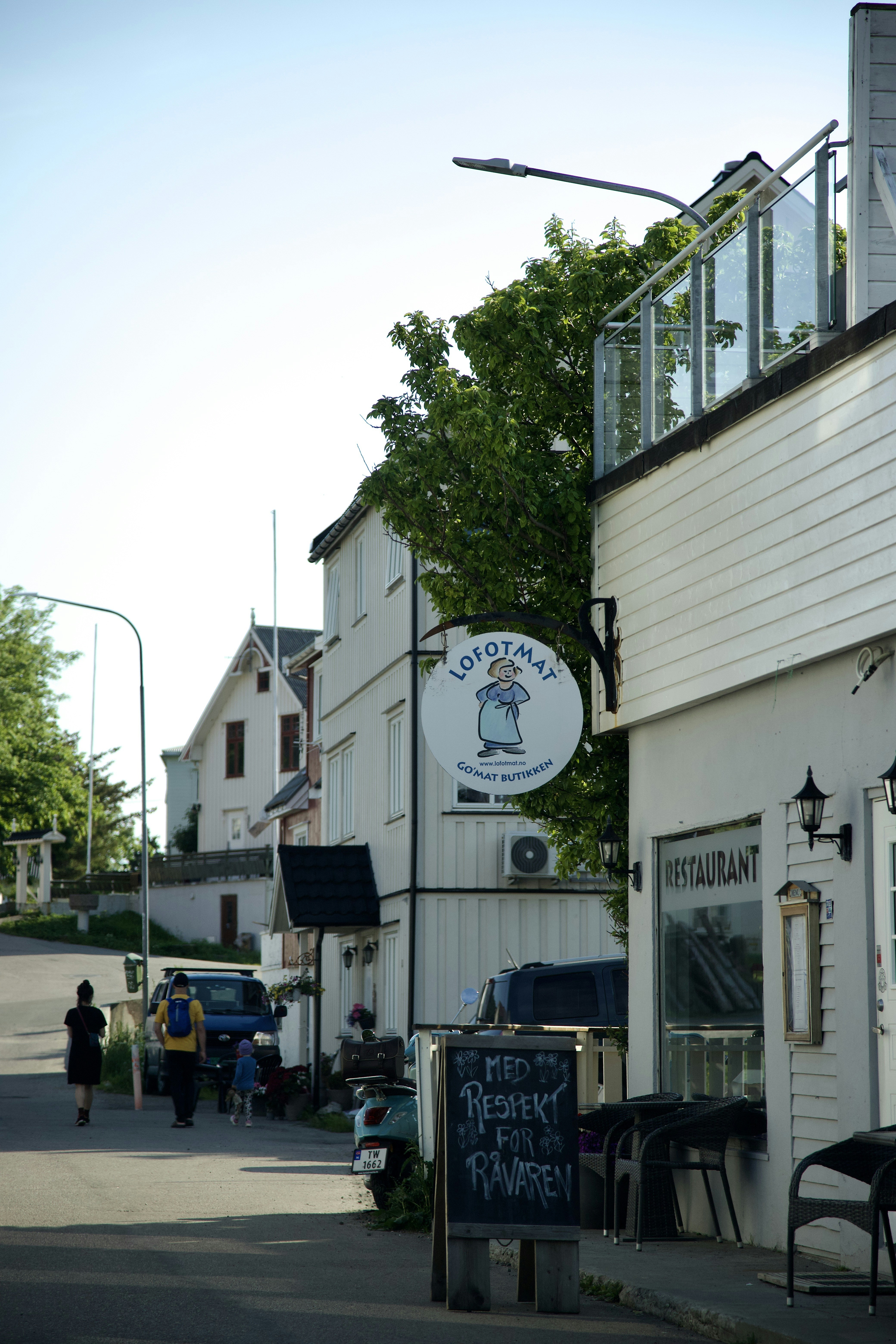 Round Logo Illuminates a Quiet Sunlit Street