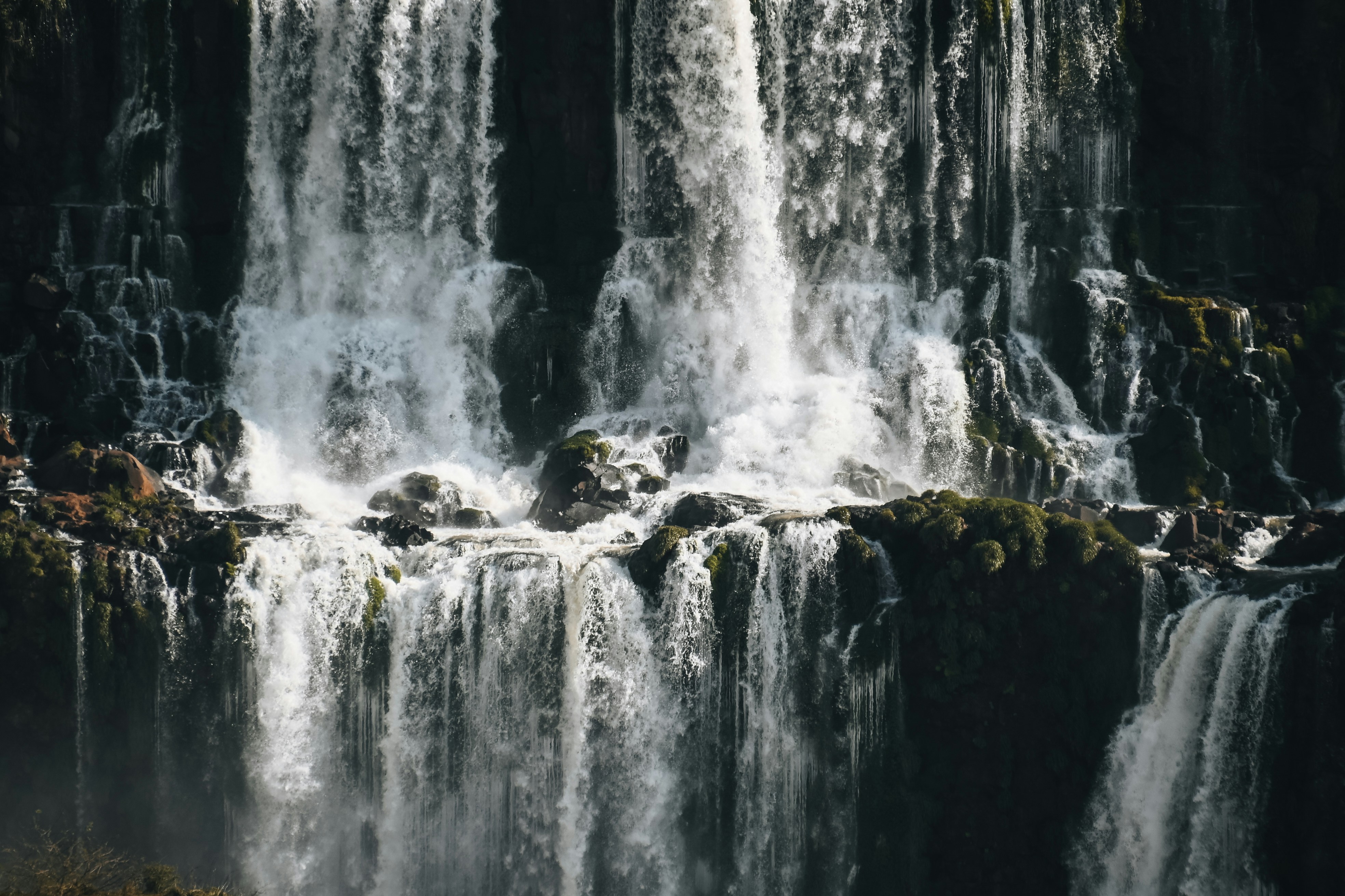 A waterfall with rocks photo – Free Grey Image on Unsplash