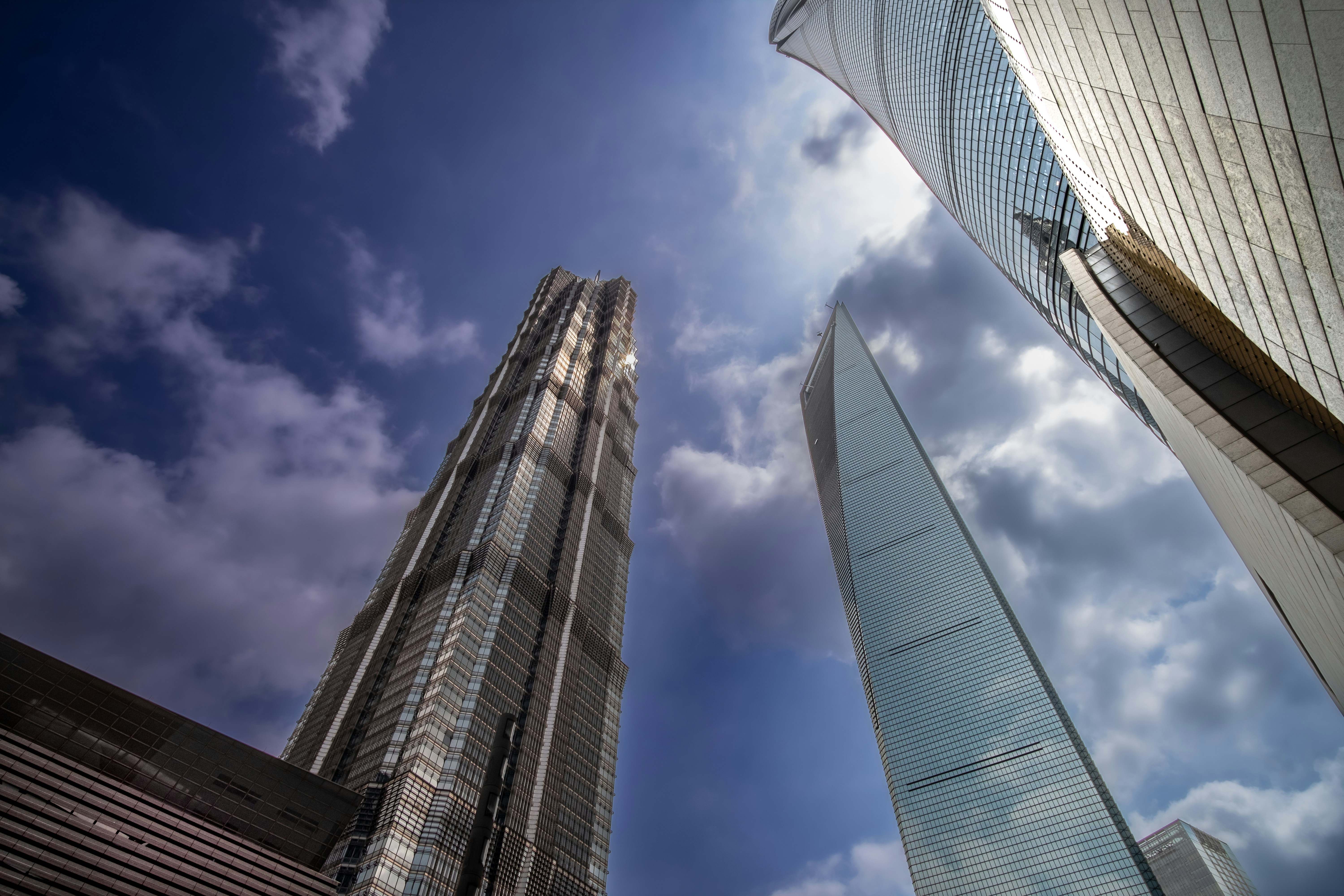 Vertical Convergence: Glass Towers Reaching for the Blue Sky