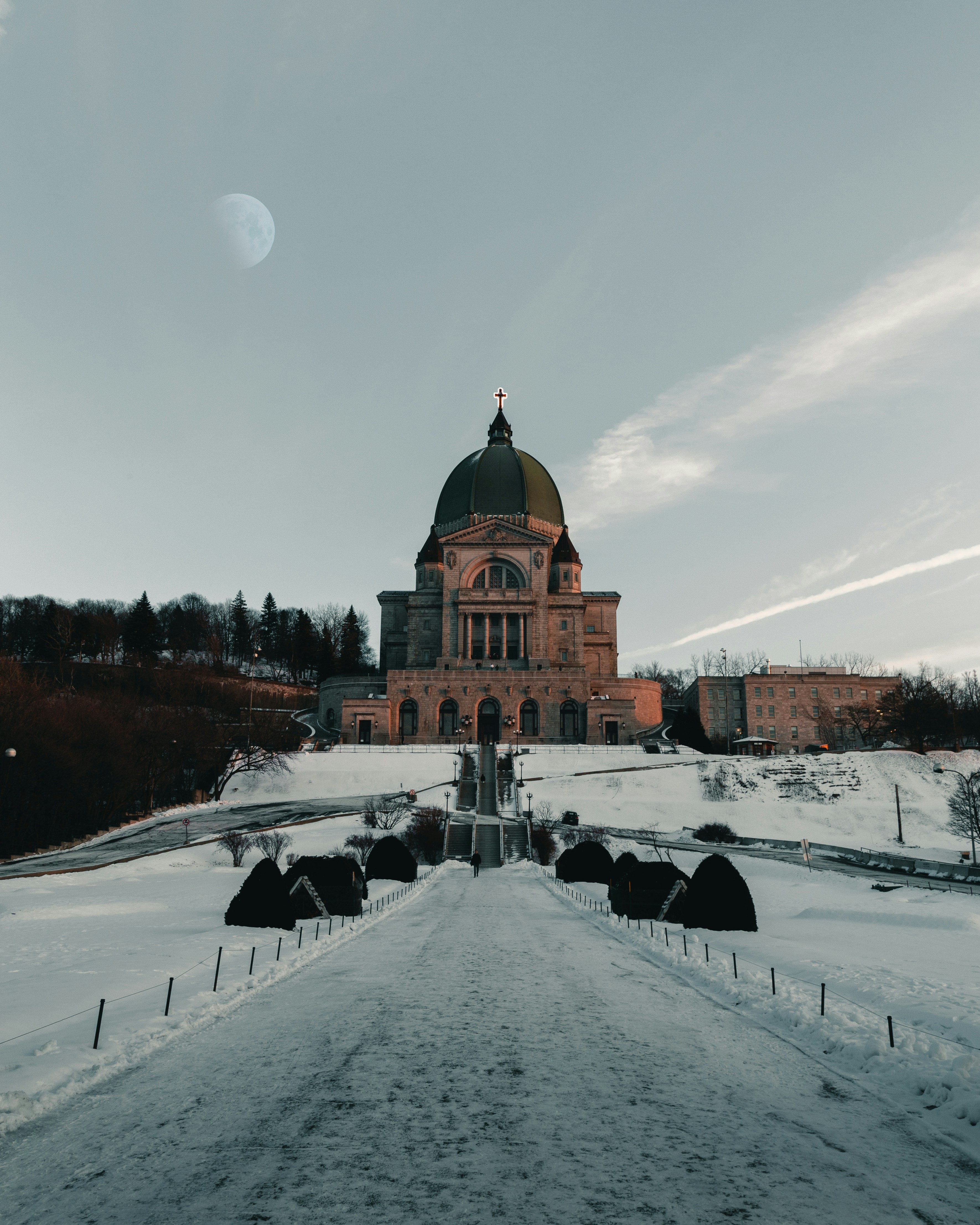 a building with a dome and a dome on top in a snowy area