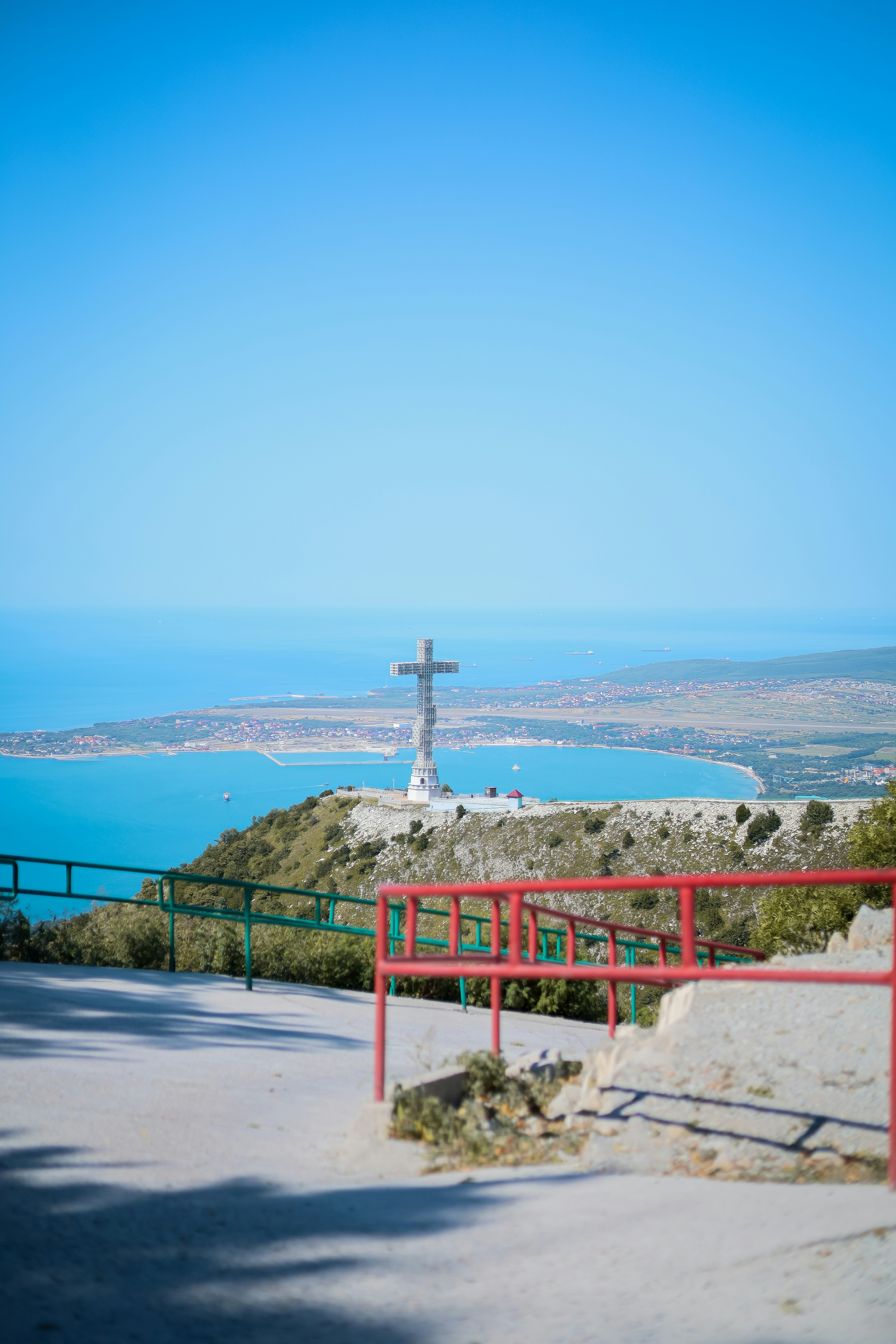 A red railing overlooking a body of water photo – Free Blue Image on ...