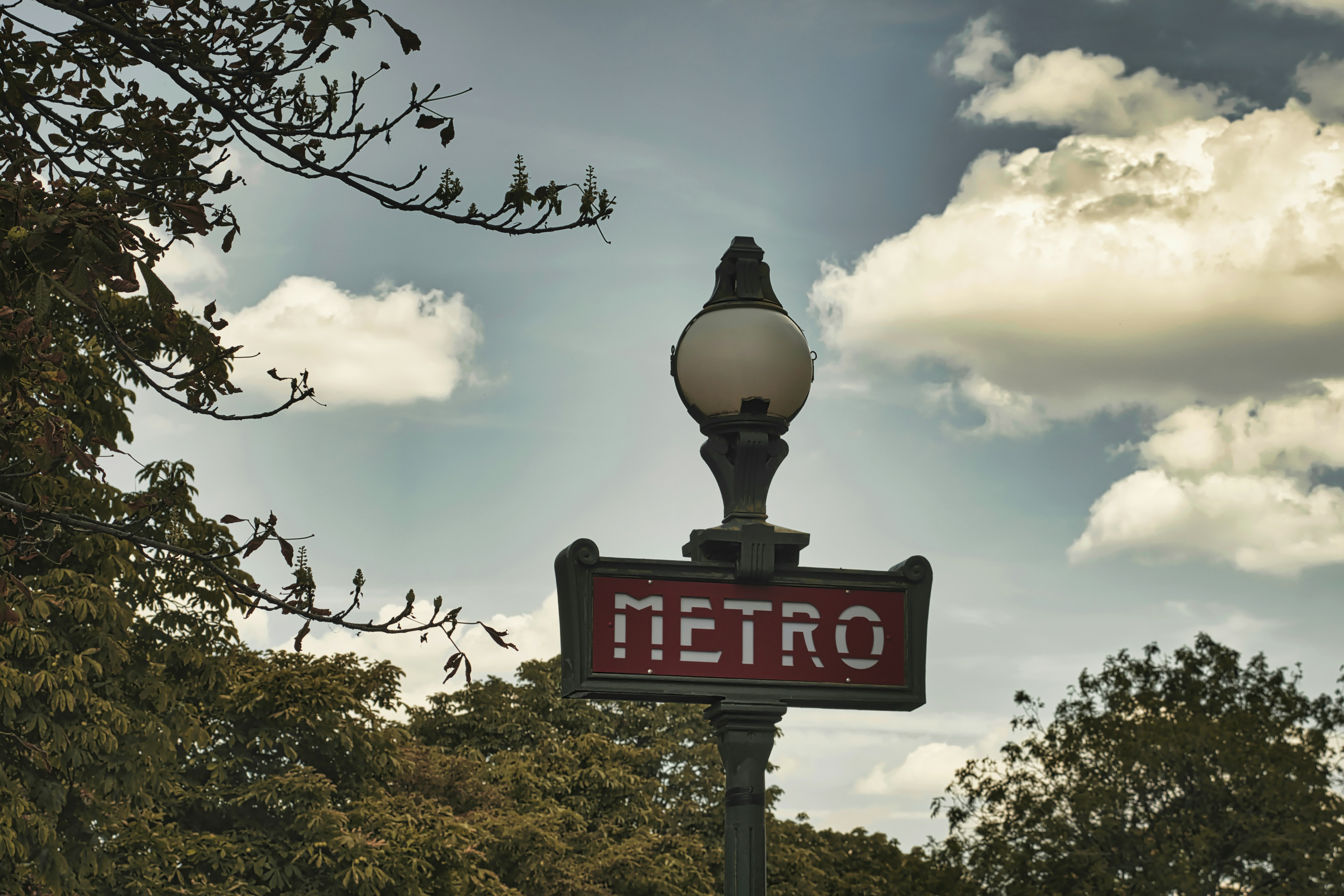 Retro Metro Sign Under a Painterly Sky