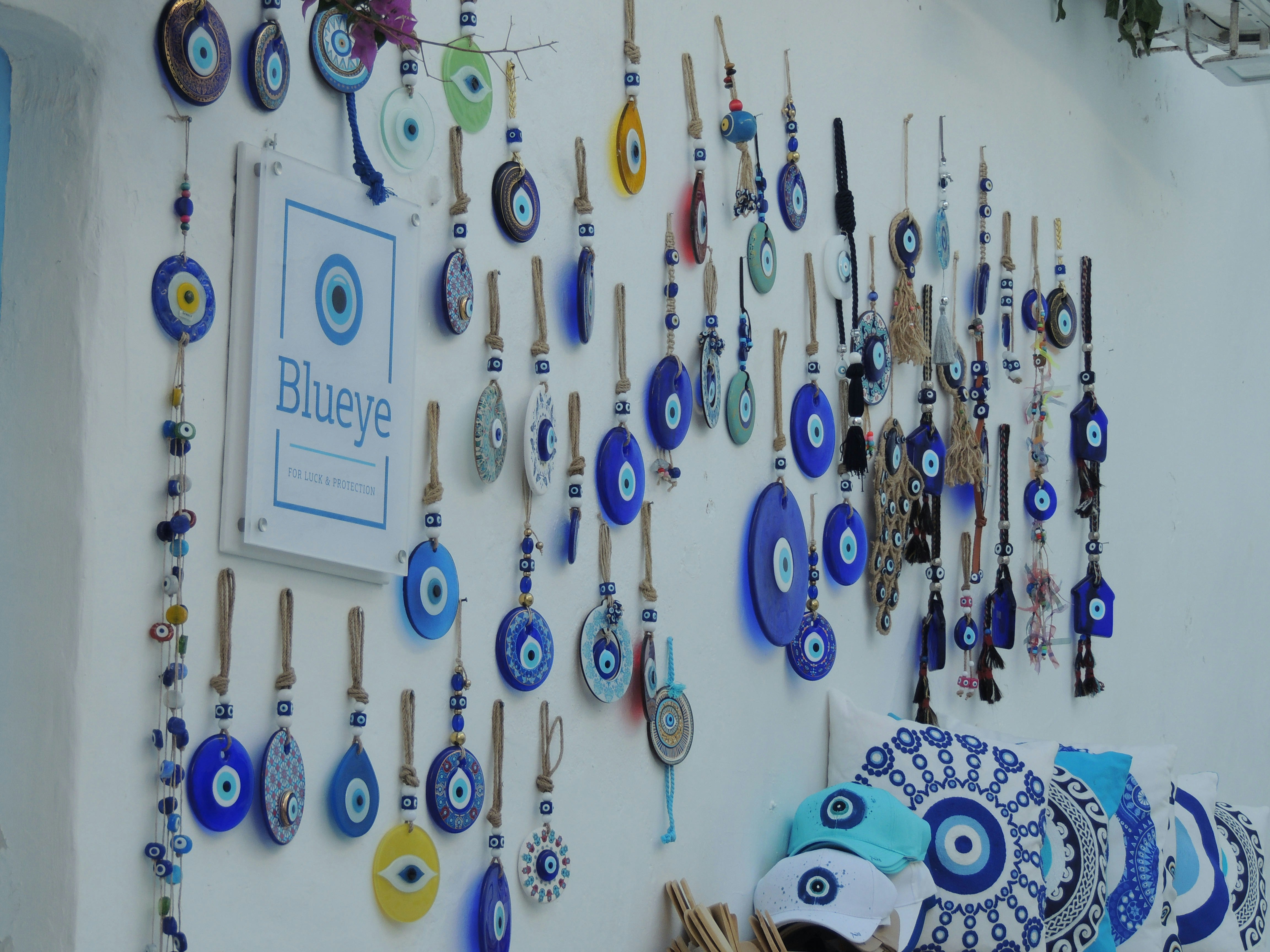 Blue Eye Motif Gallery: Hanging Ornaments on a Whitewashed Wall