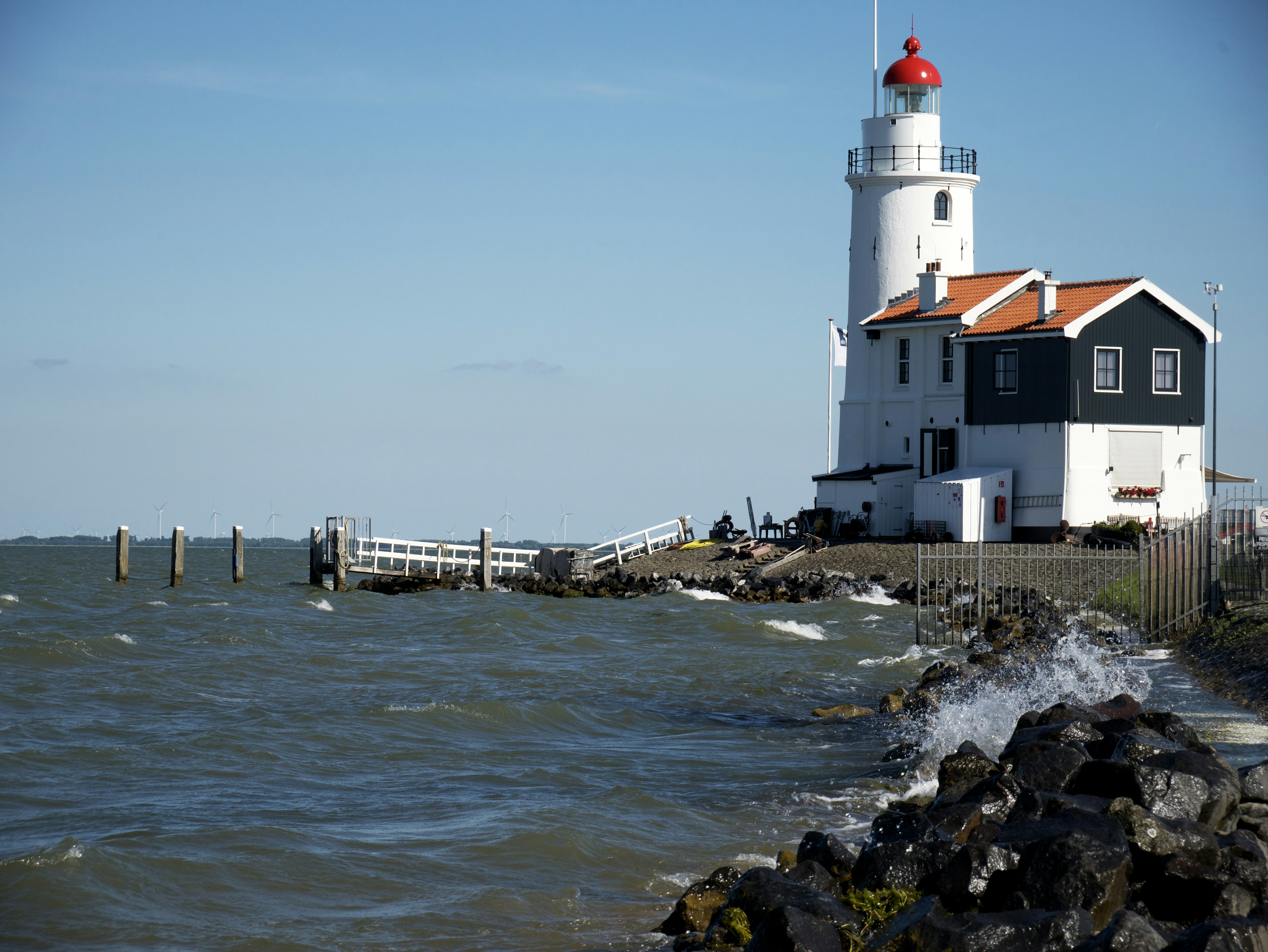Lighthouse Sentinel: A Coastal Outpost on the Calm Sea