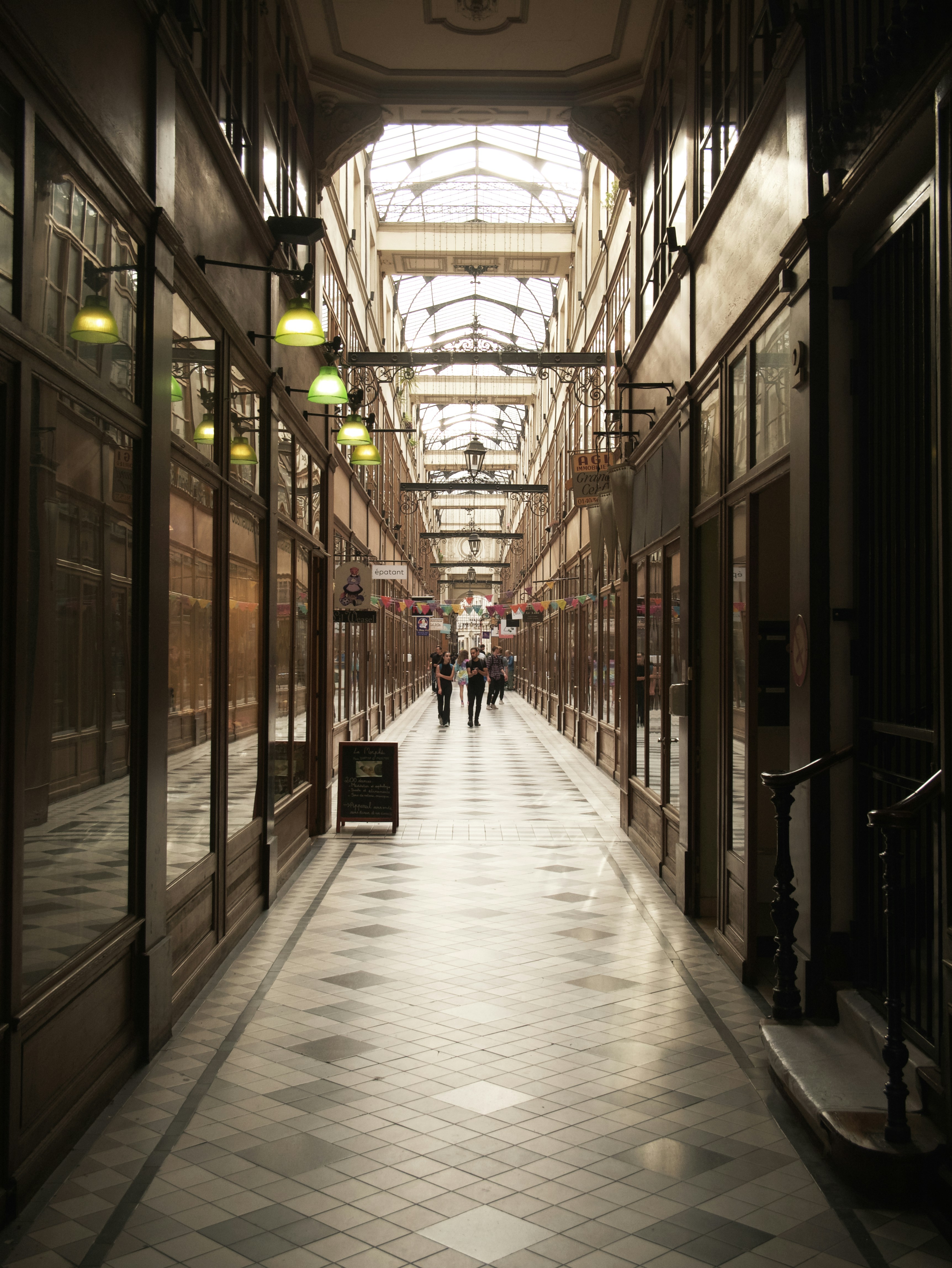 A walkway between buildings photo – Free Corridor Image on Unsplash