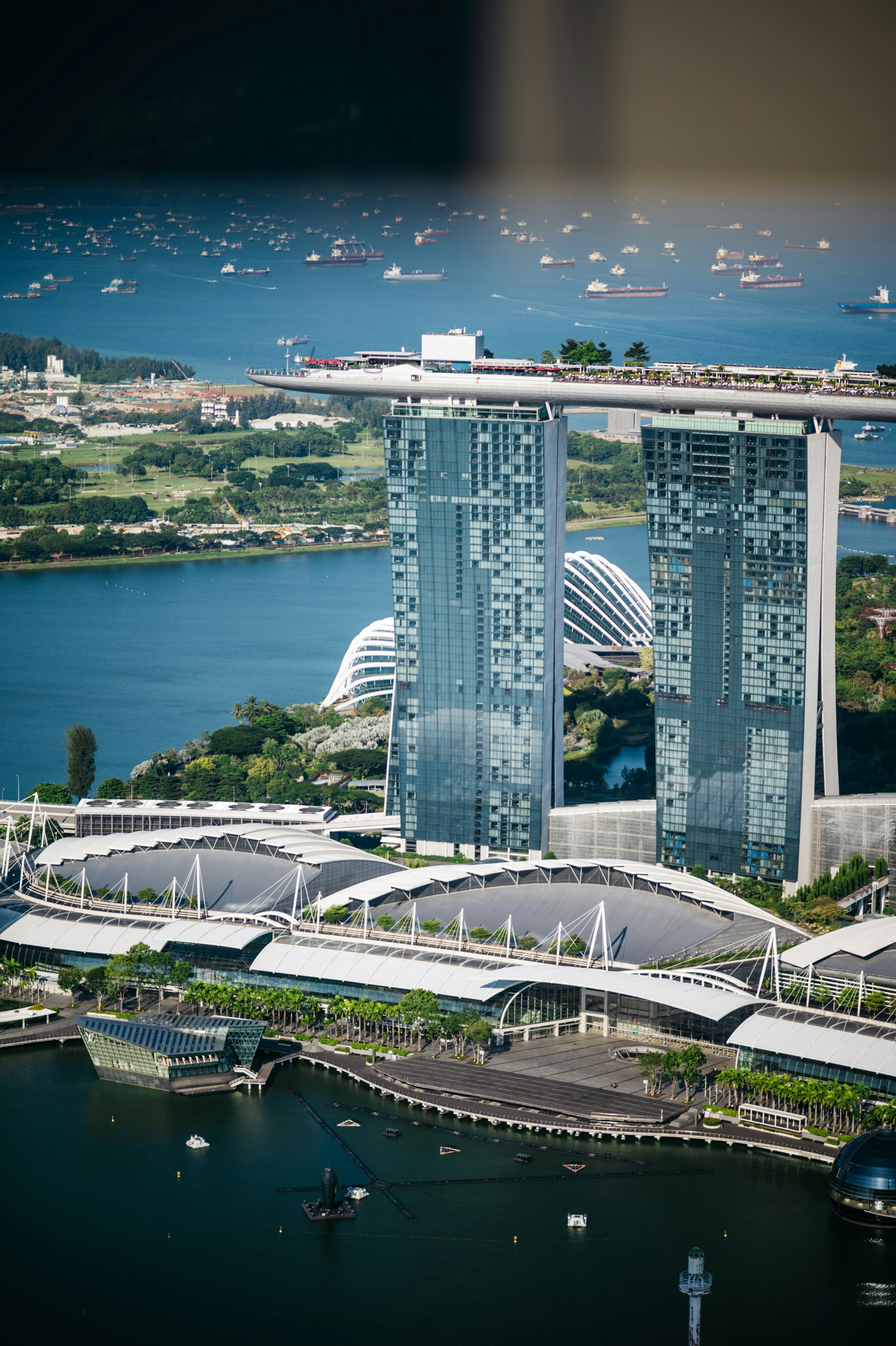 A group of buildings next to a body of water photo – Free Building ...