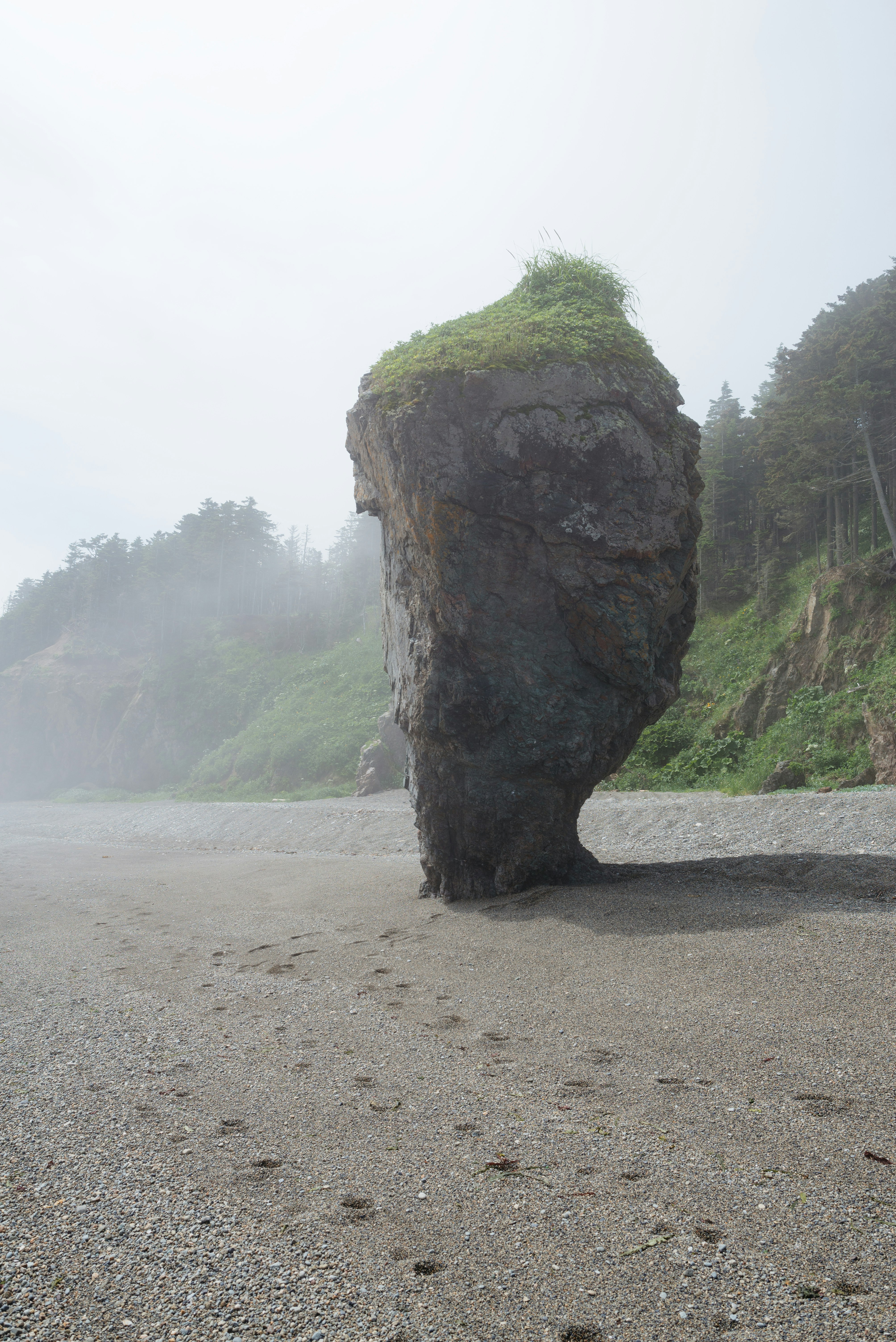 A large rock with a face carved into it photo – Free Russia Image on ...