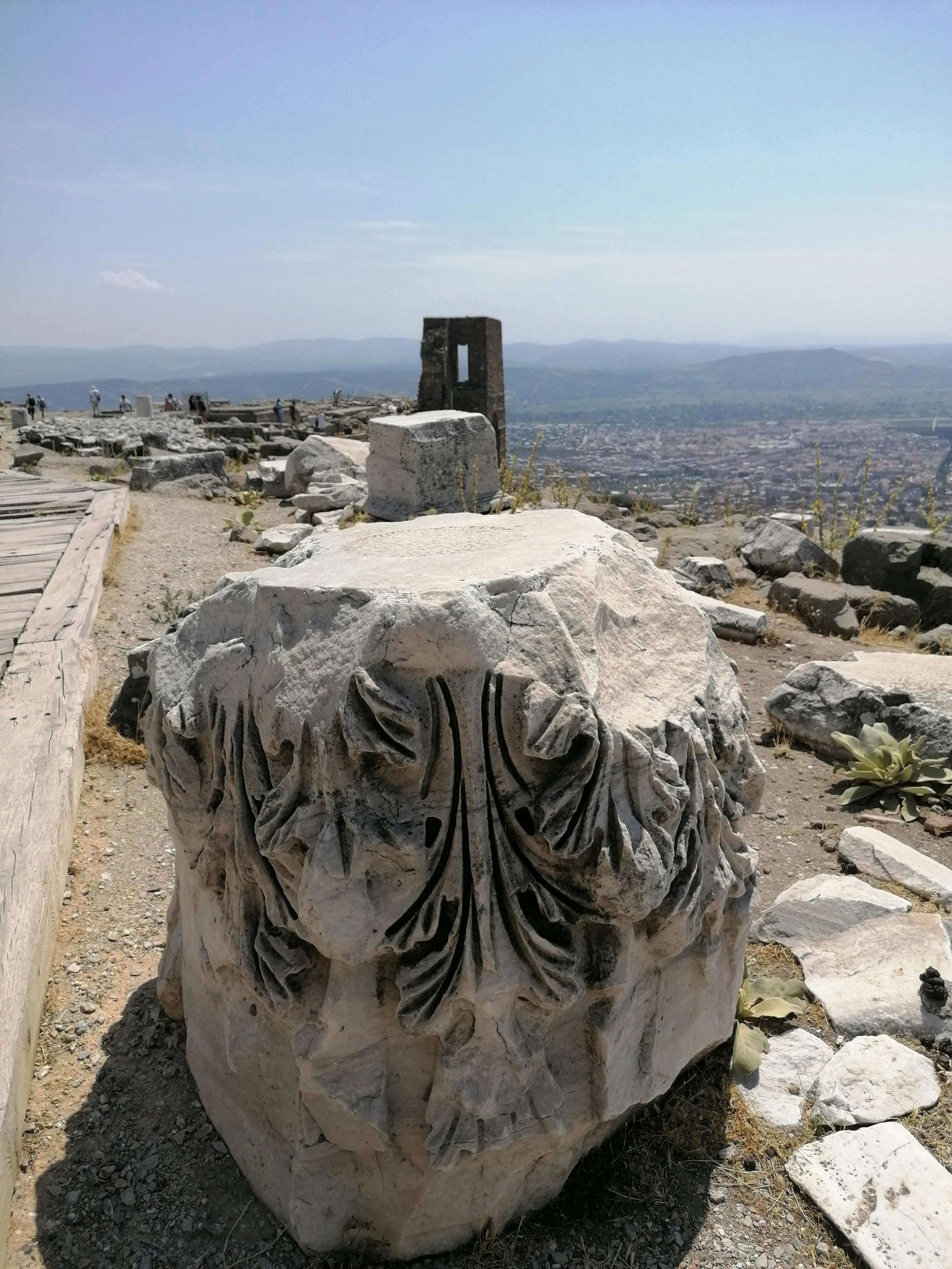 a large rock with a stone structure in the middle of it
