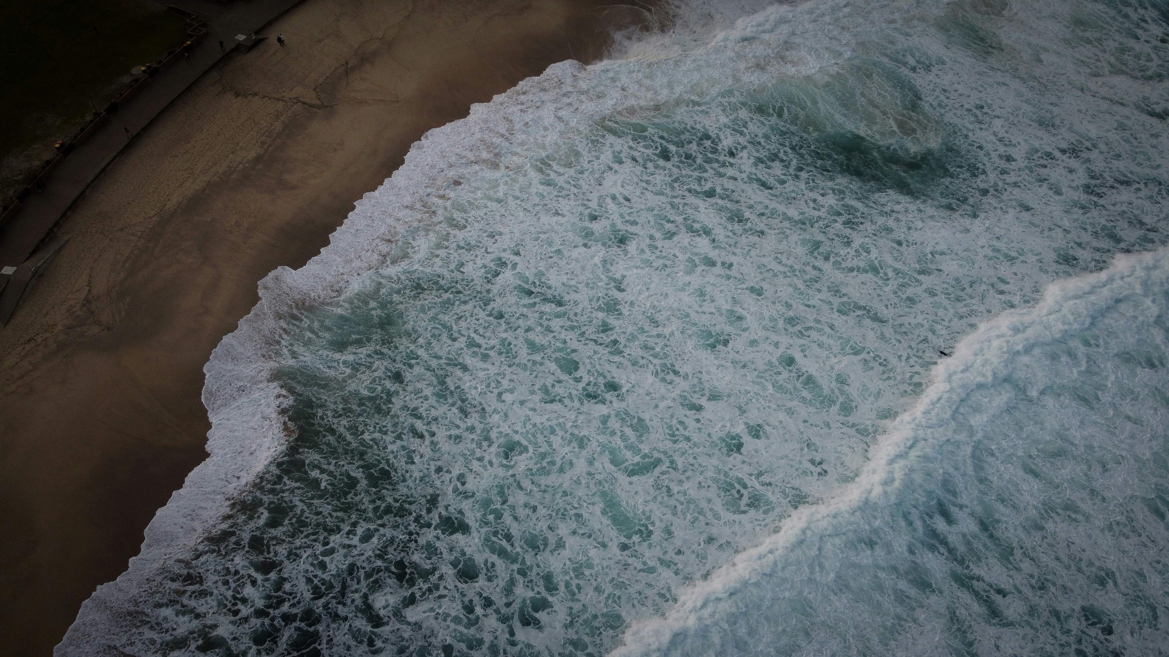Foam Ribbon Tracing the Diagonal Shoreline