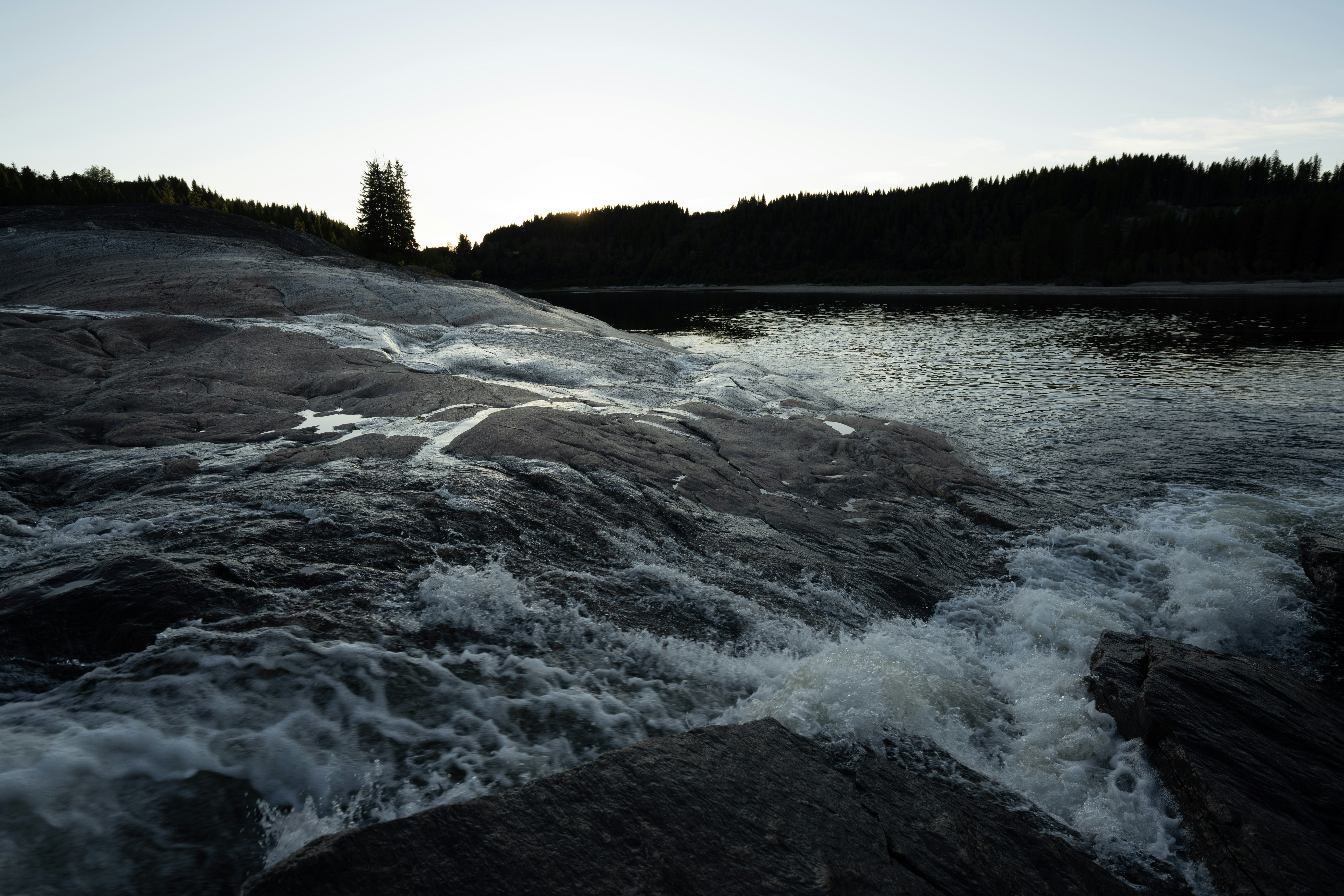 A peaceful view of the raging waters in Grong, Norway | a river with a waterfall