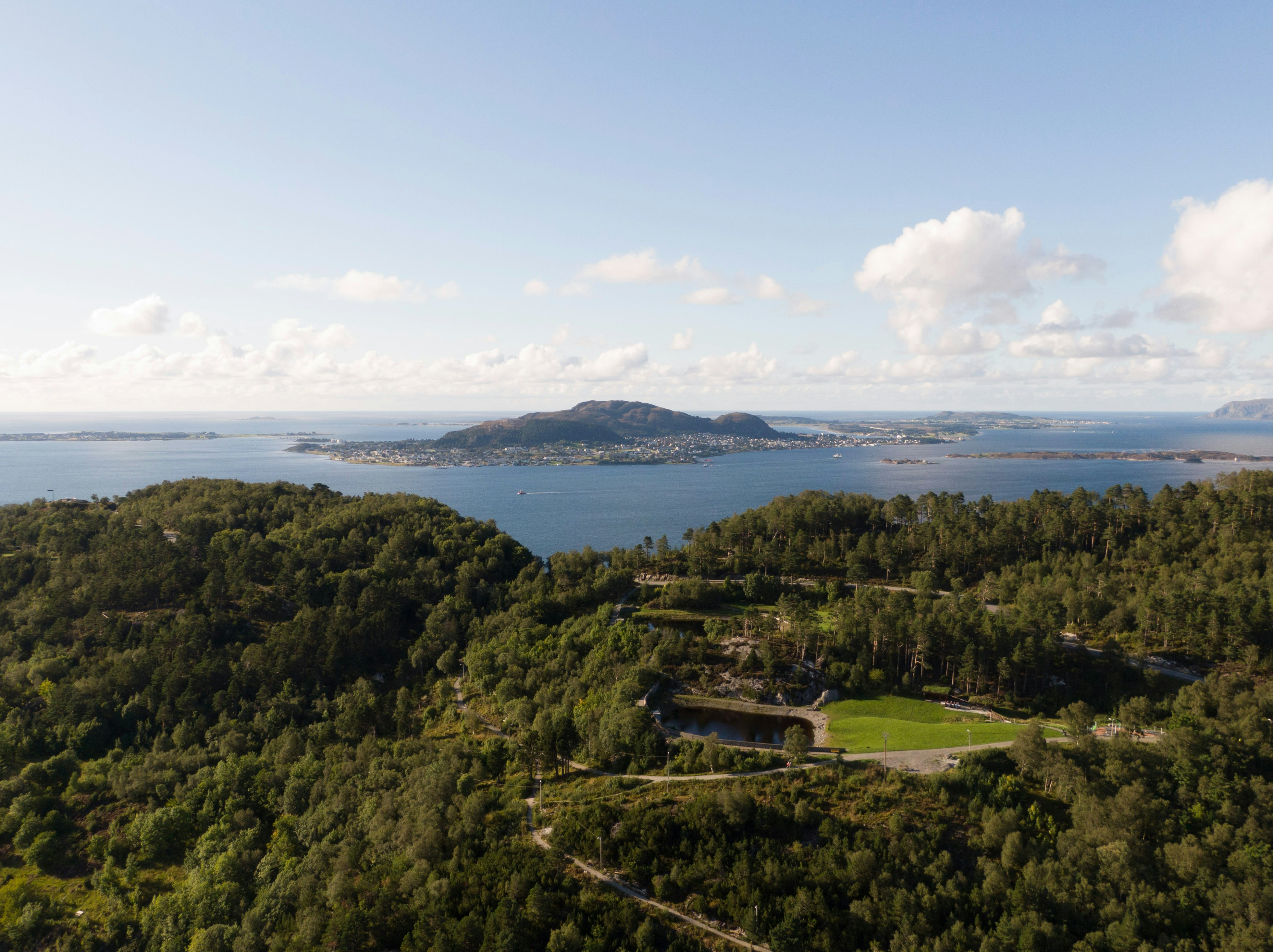 Islands at the Edge: A Coastal Aerial Over Pine and Sea