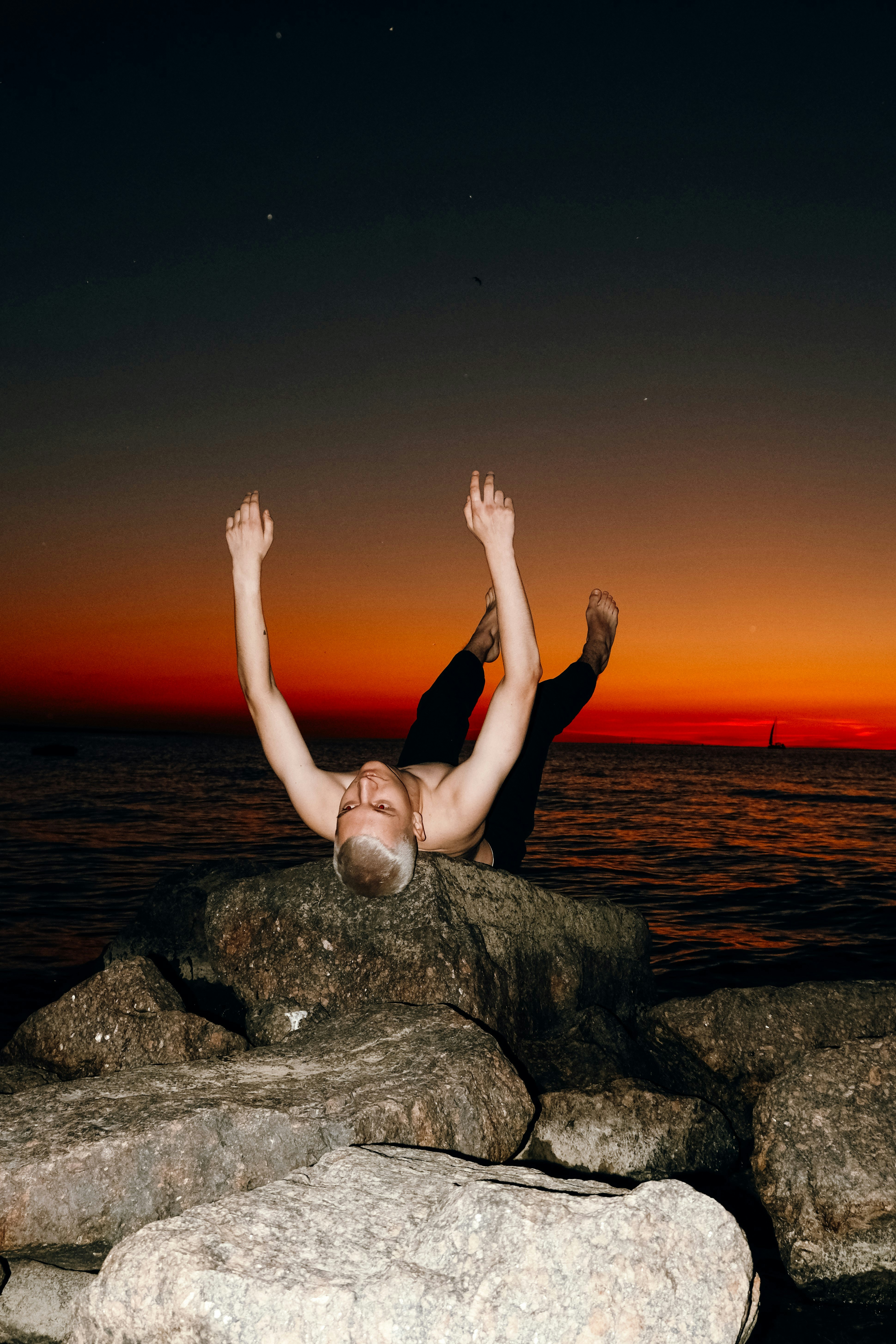 Midair Sunrise: Daredevil on the Rocks at Dusk
