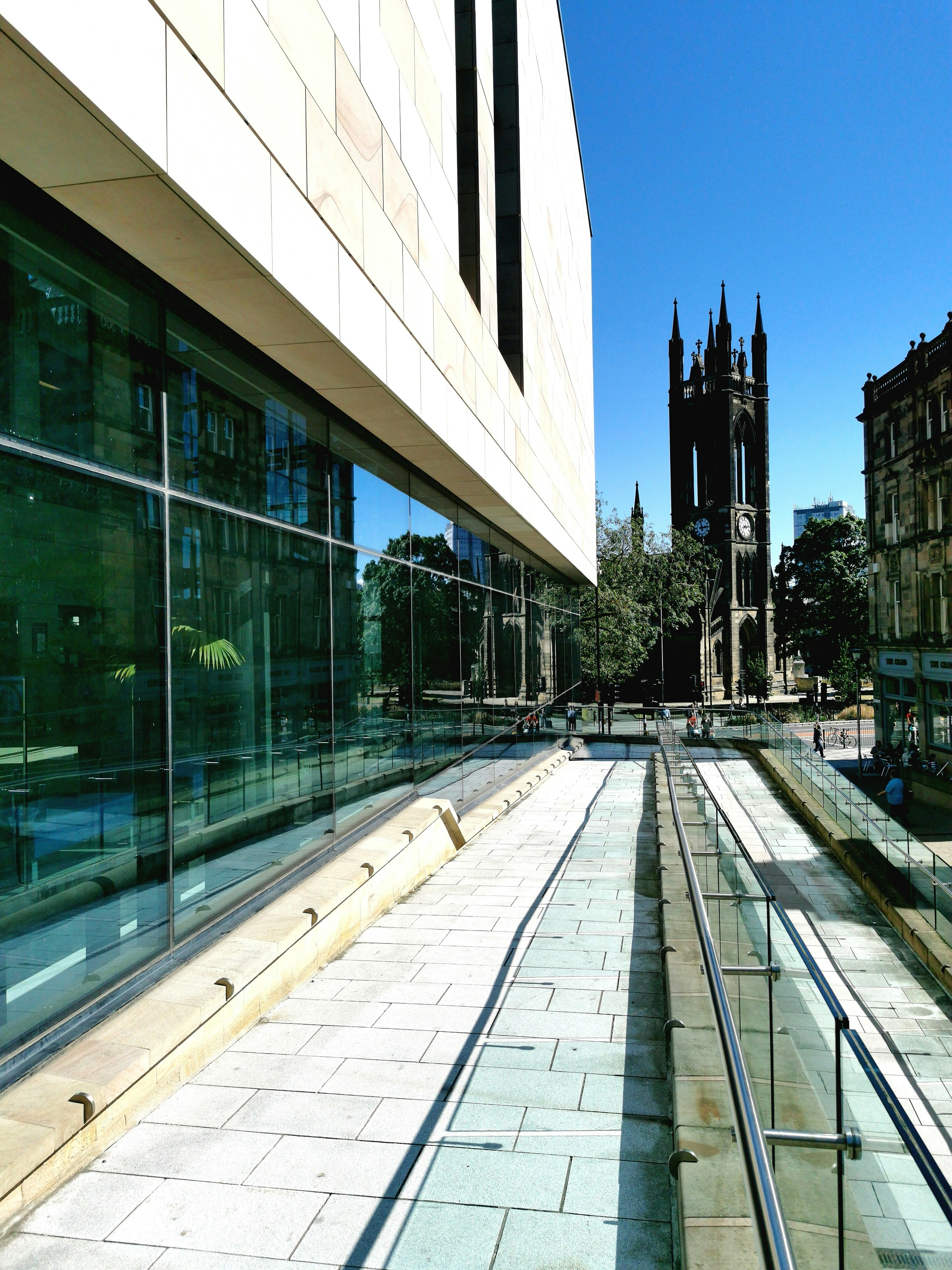 Glass Corridor Toward a Gothic Spire