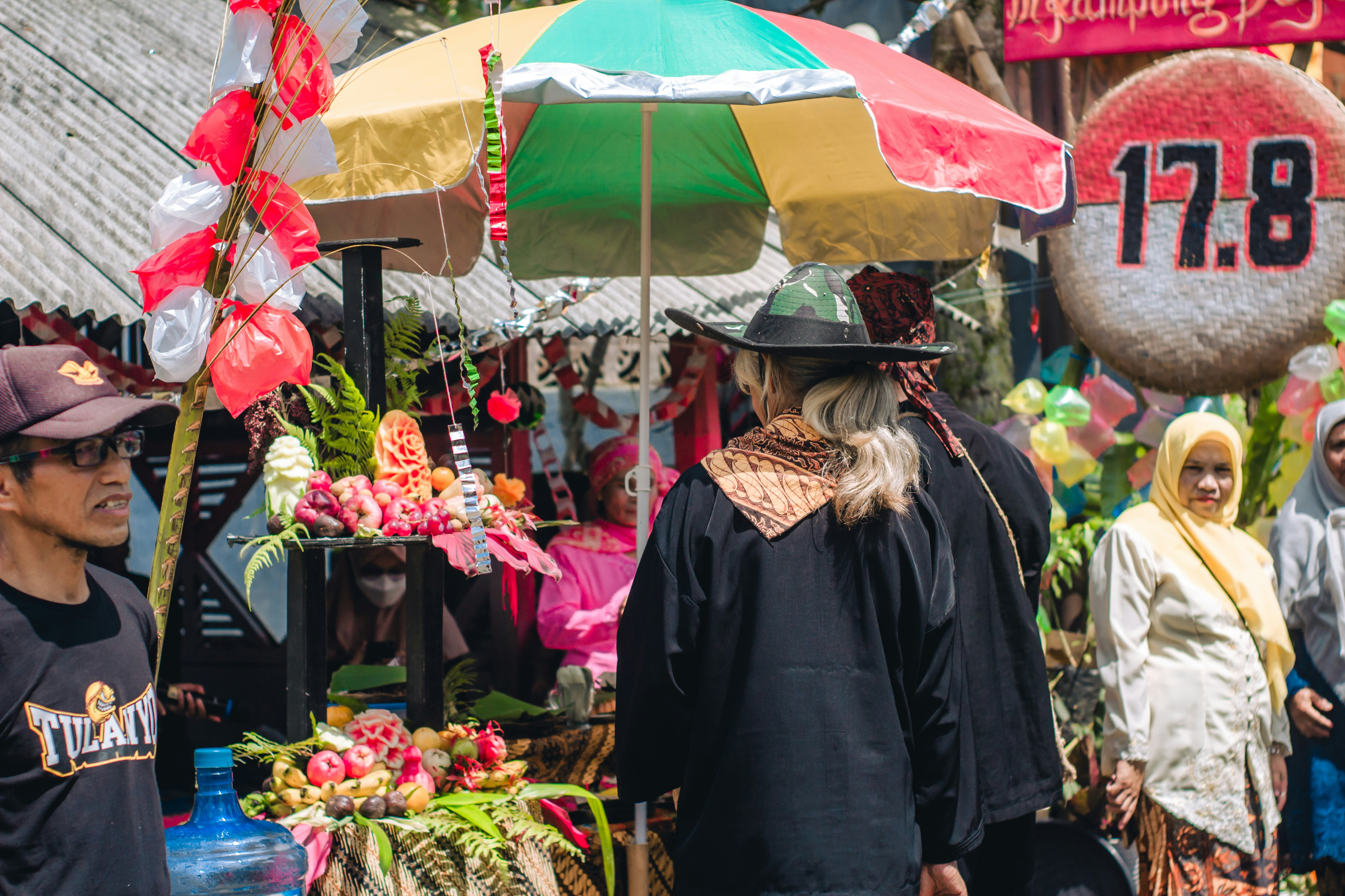 A person stands under an umbrella photo – Free Tasikmalaya regency ...