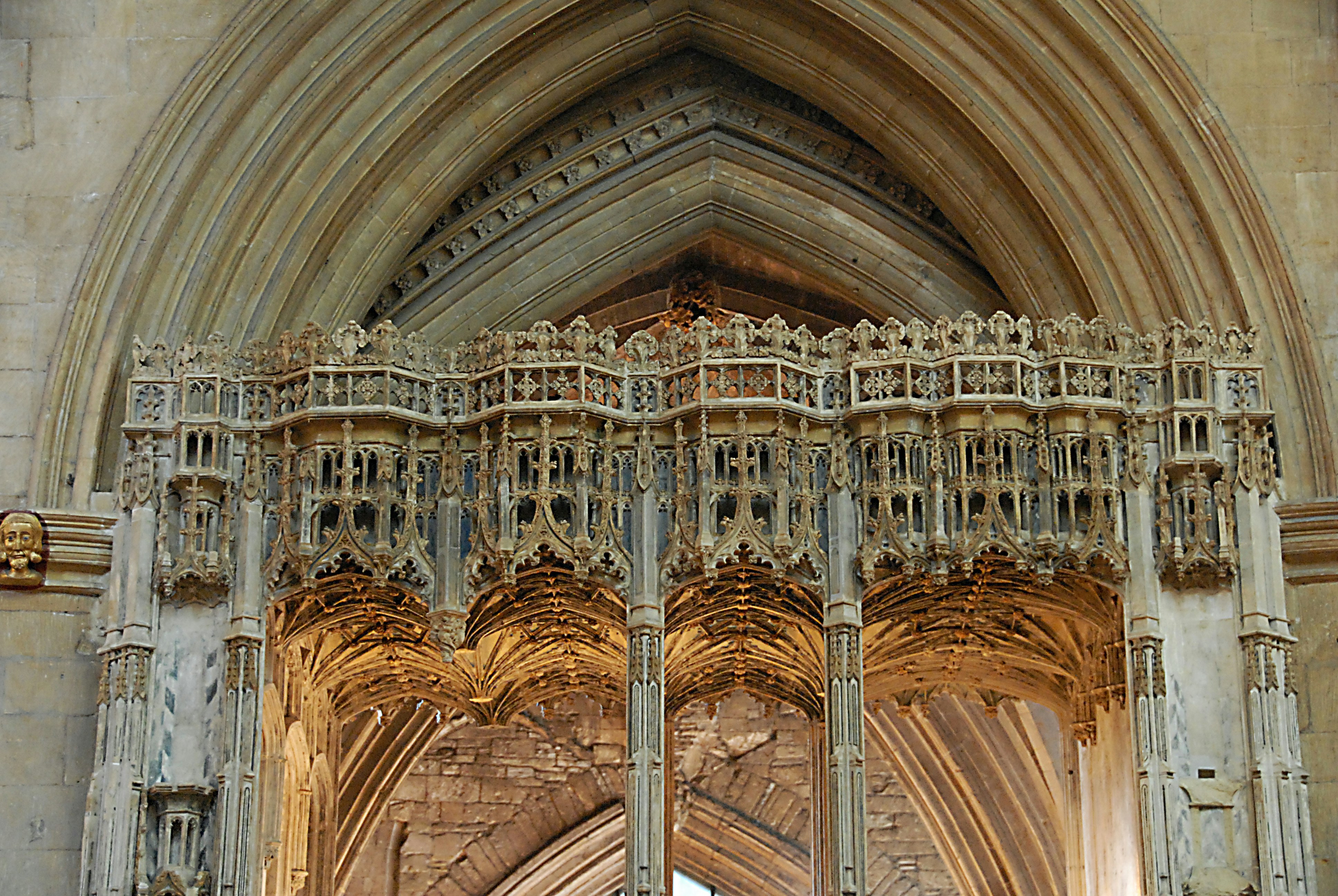 Stone Lace Gate: Intricate Gothic Carvings Framing a Cathedral Portal