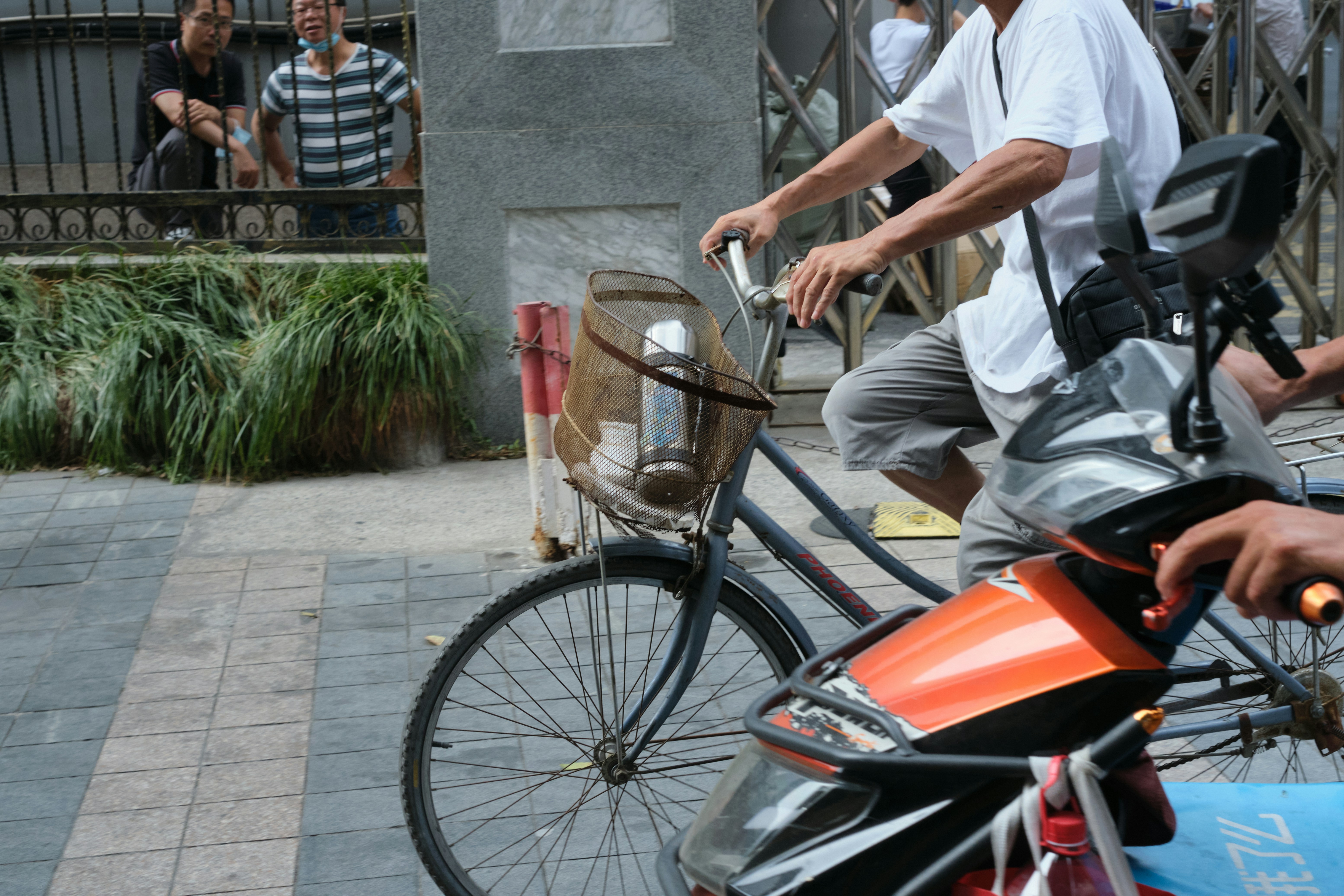 Front Basket on a City Glide: Motion and Metal in Urban Light