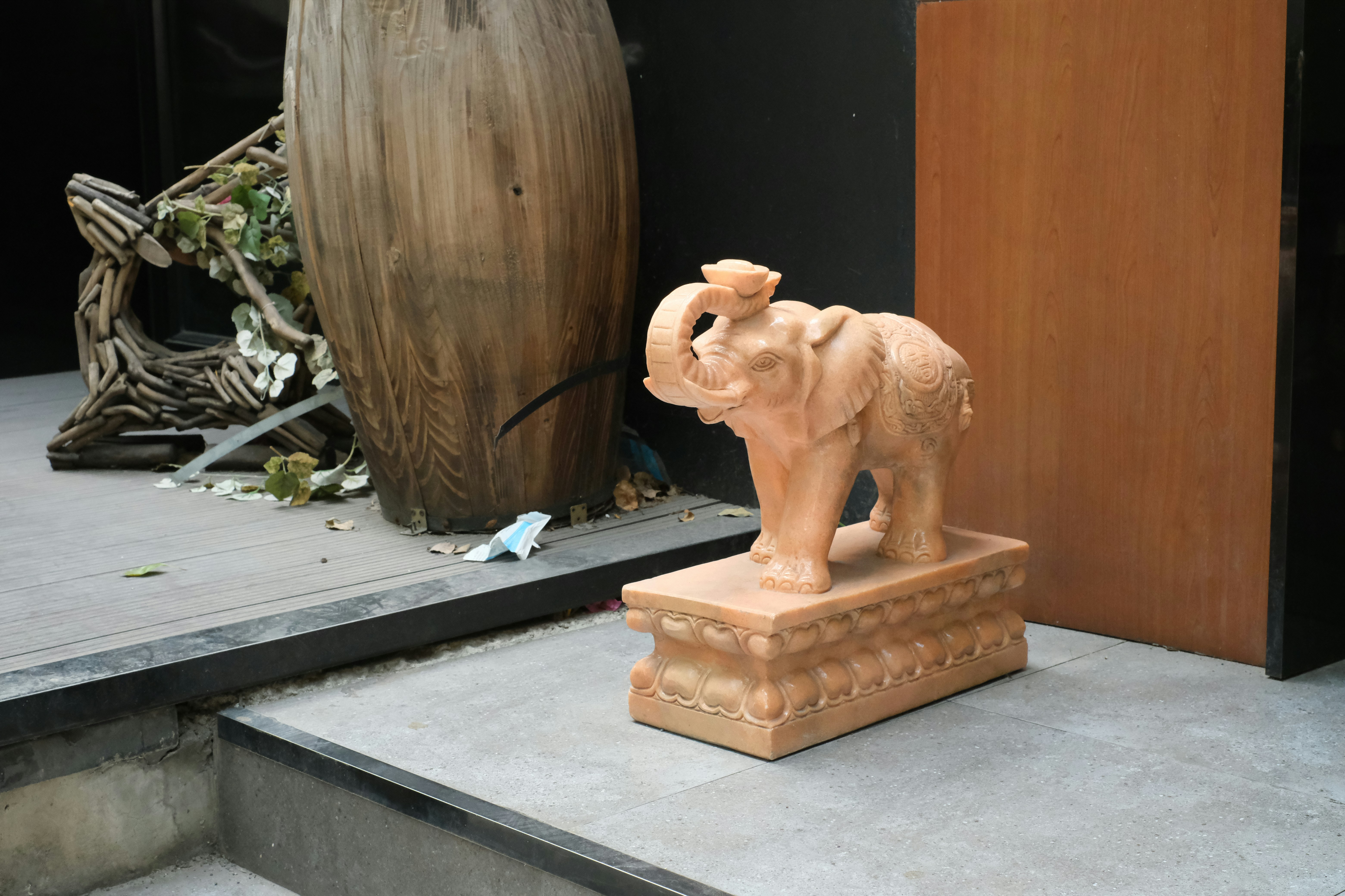 a couple of clay elephants