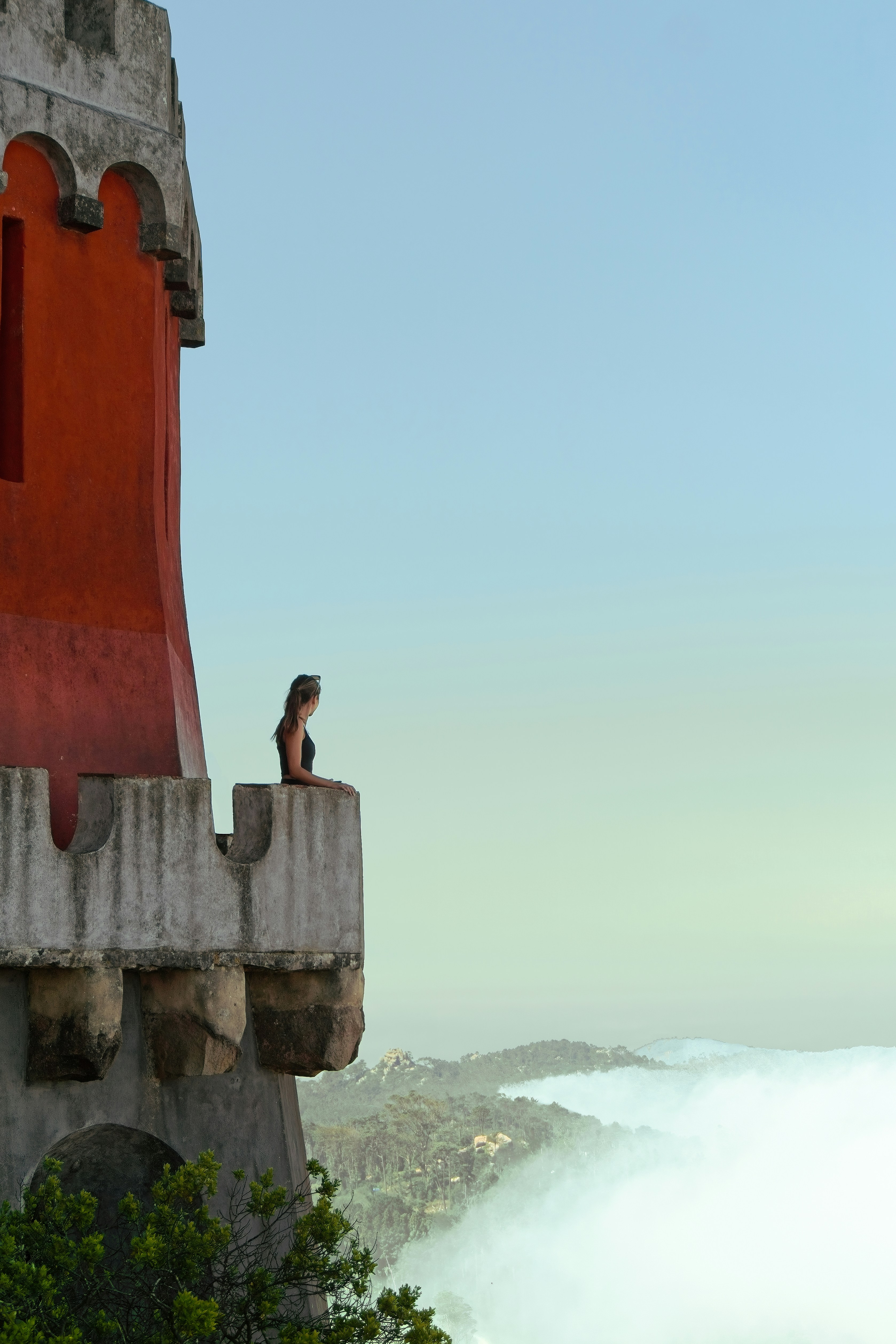 A person standing on a ledge above a waterfall photo – Free Sintra ...