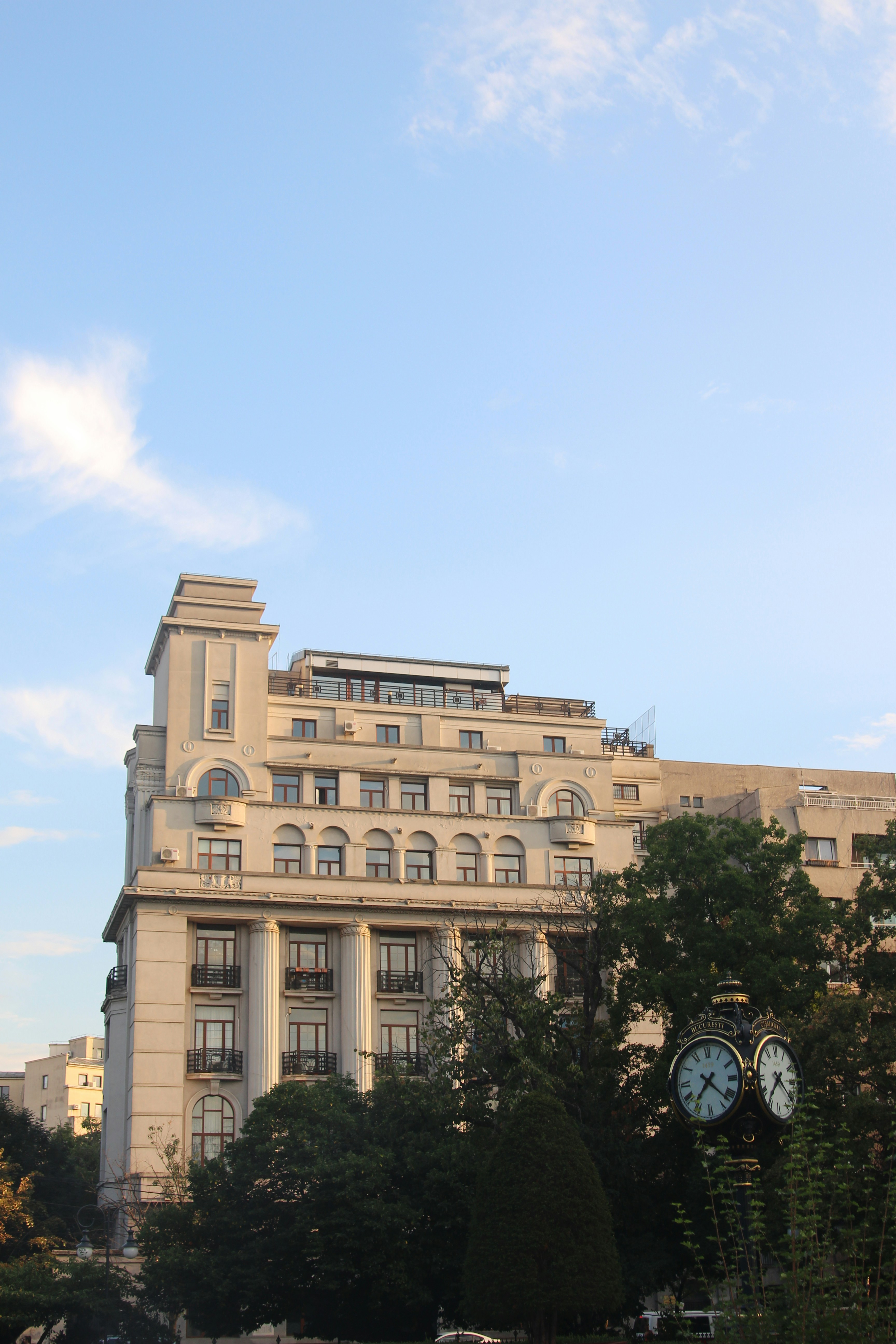 A large building with a clock tower photo – Free Bucharest Image on ...