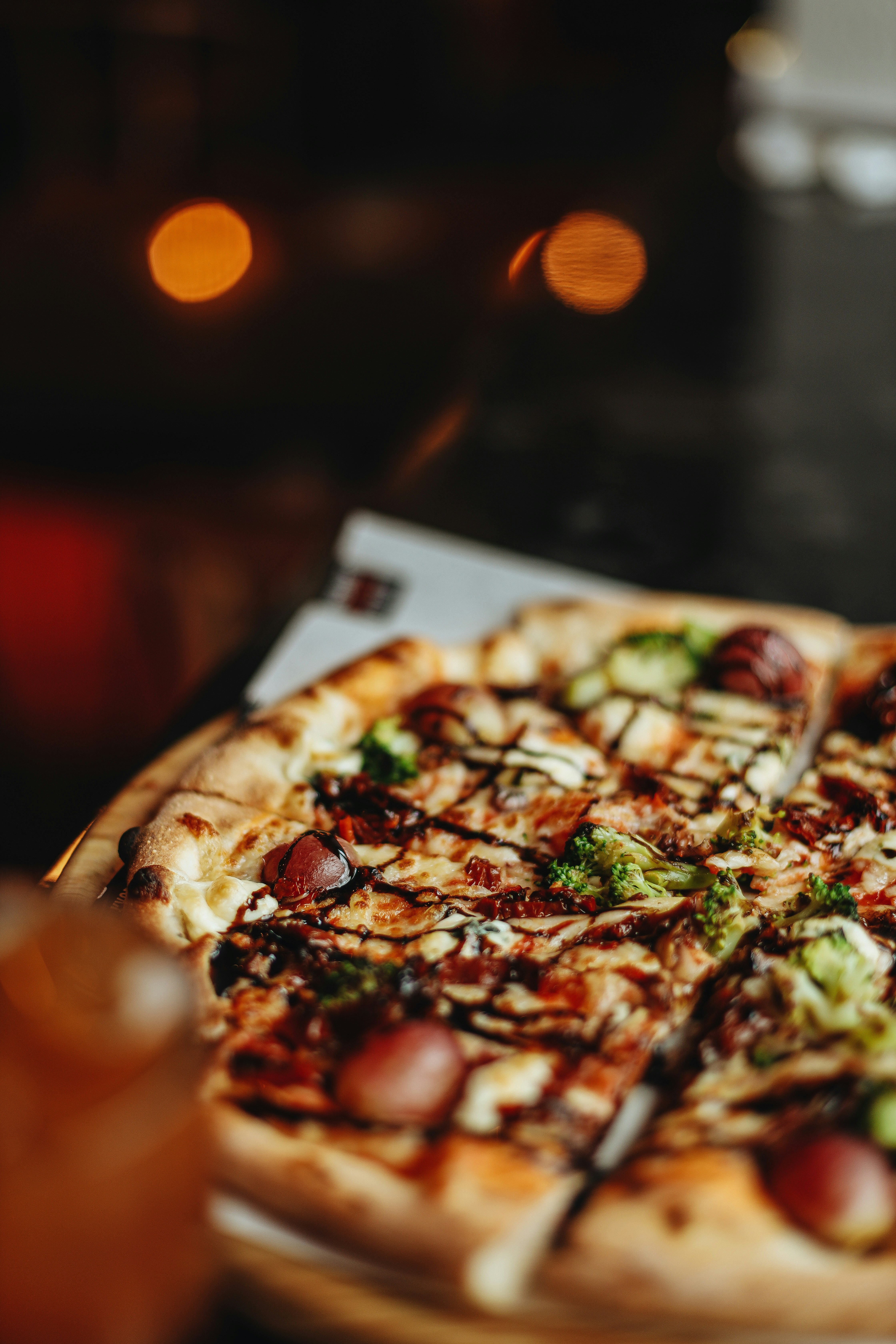 A pizza with toppings photo – Free Usa Image on Unsplash