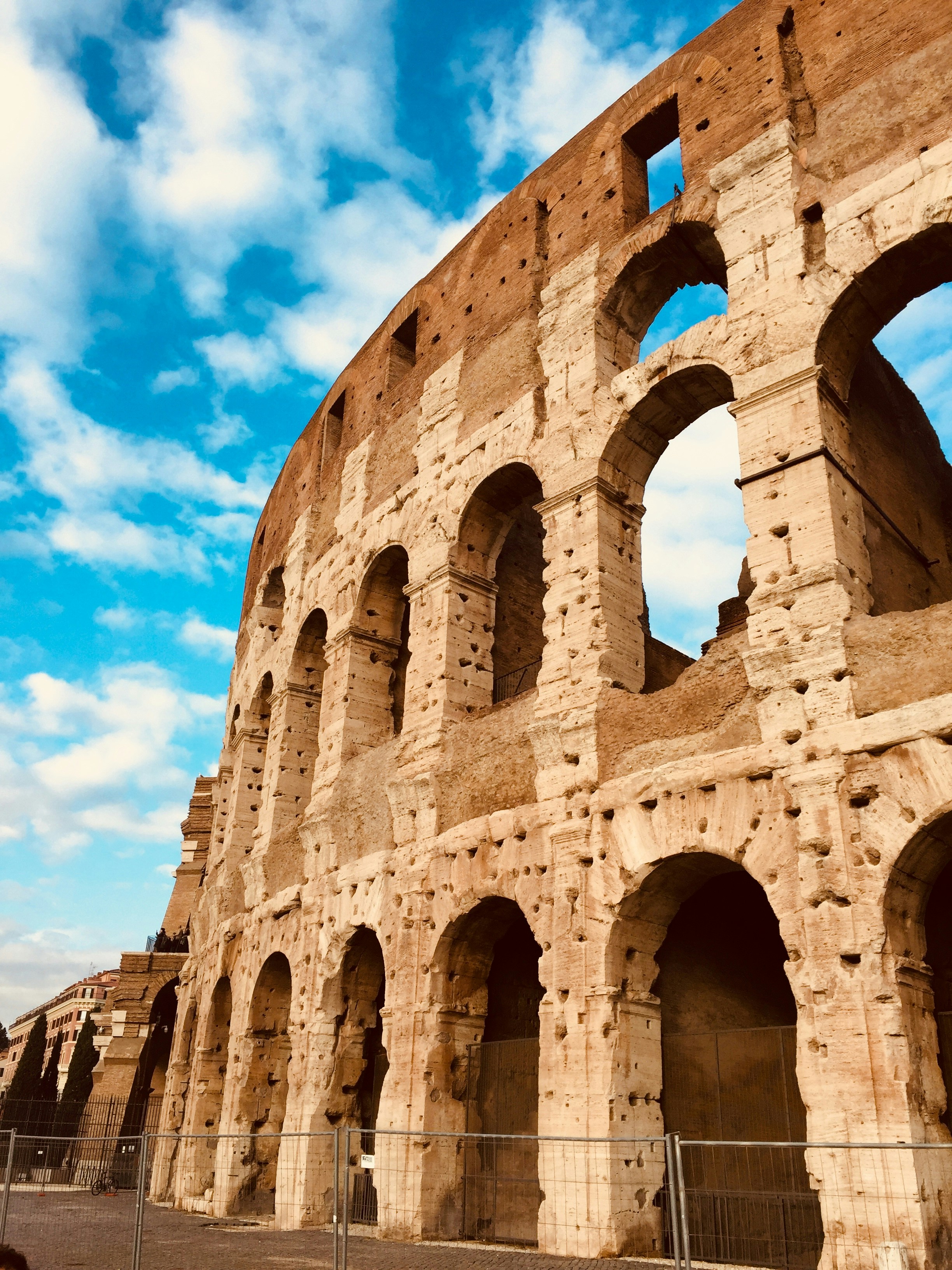 Sunlit Arcades: Weathered Colosseum Walls Reaching Toward a Bright Sky