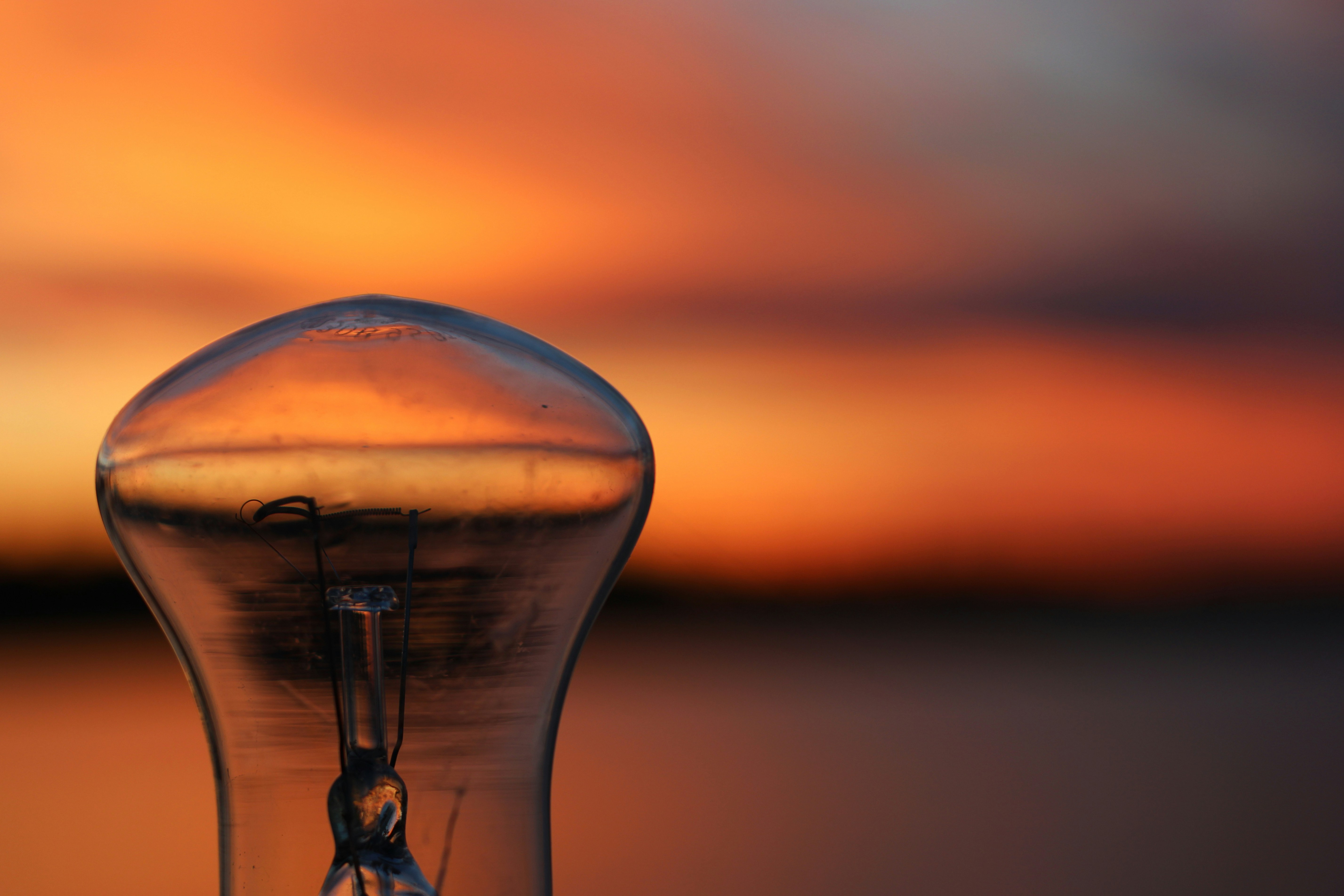 Light Bulb at Sunset: Reflections and Quiet Horizon