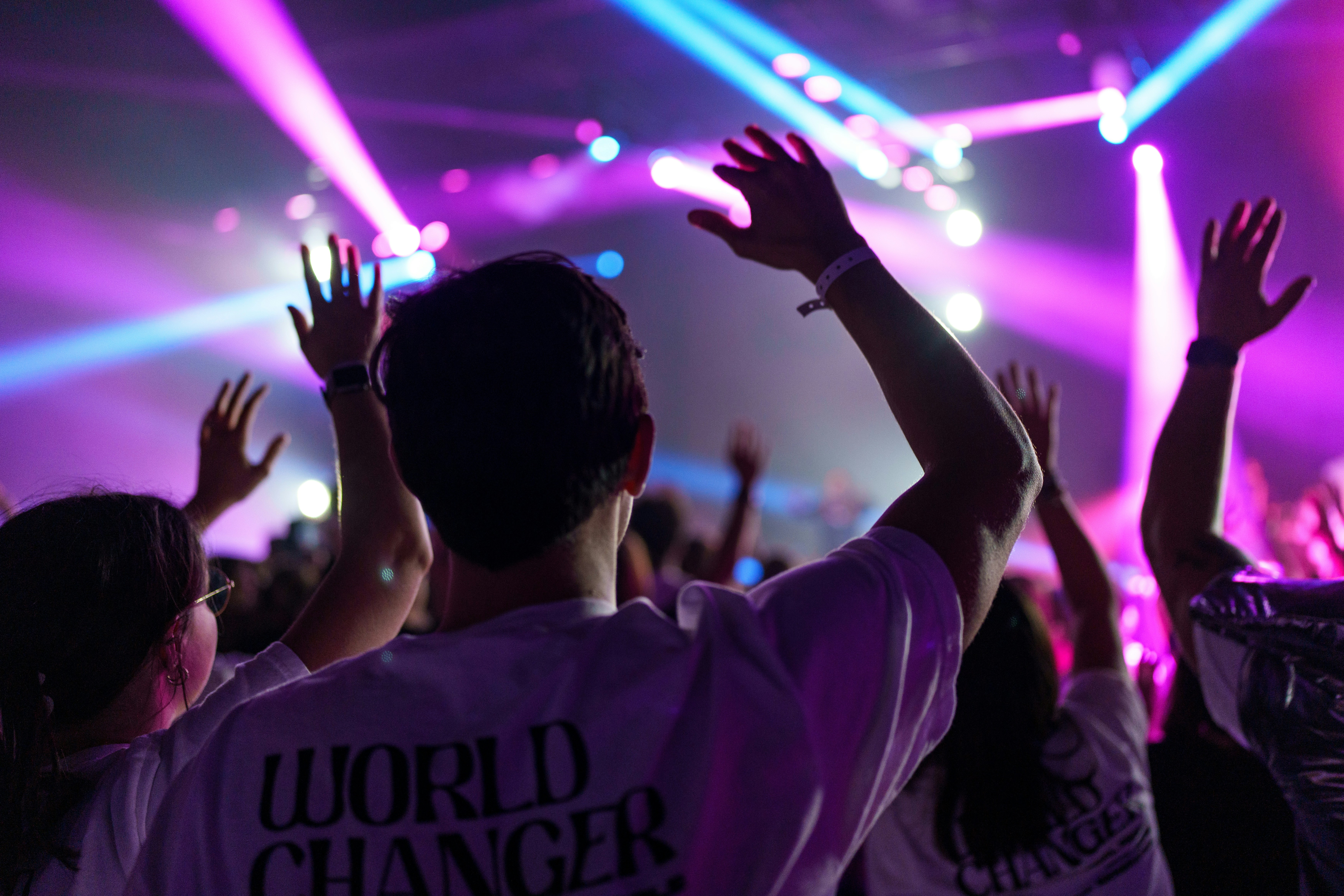 Crowd Of People With Hands Up