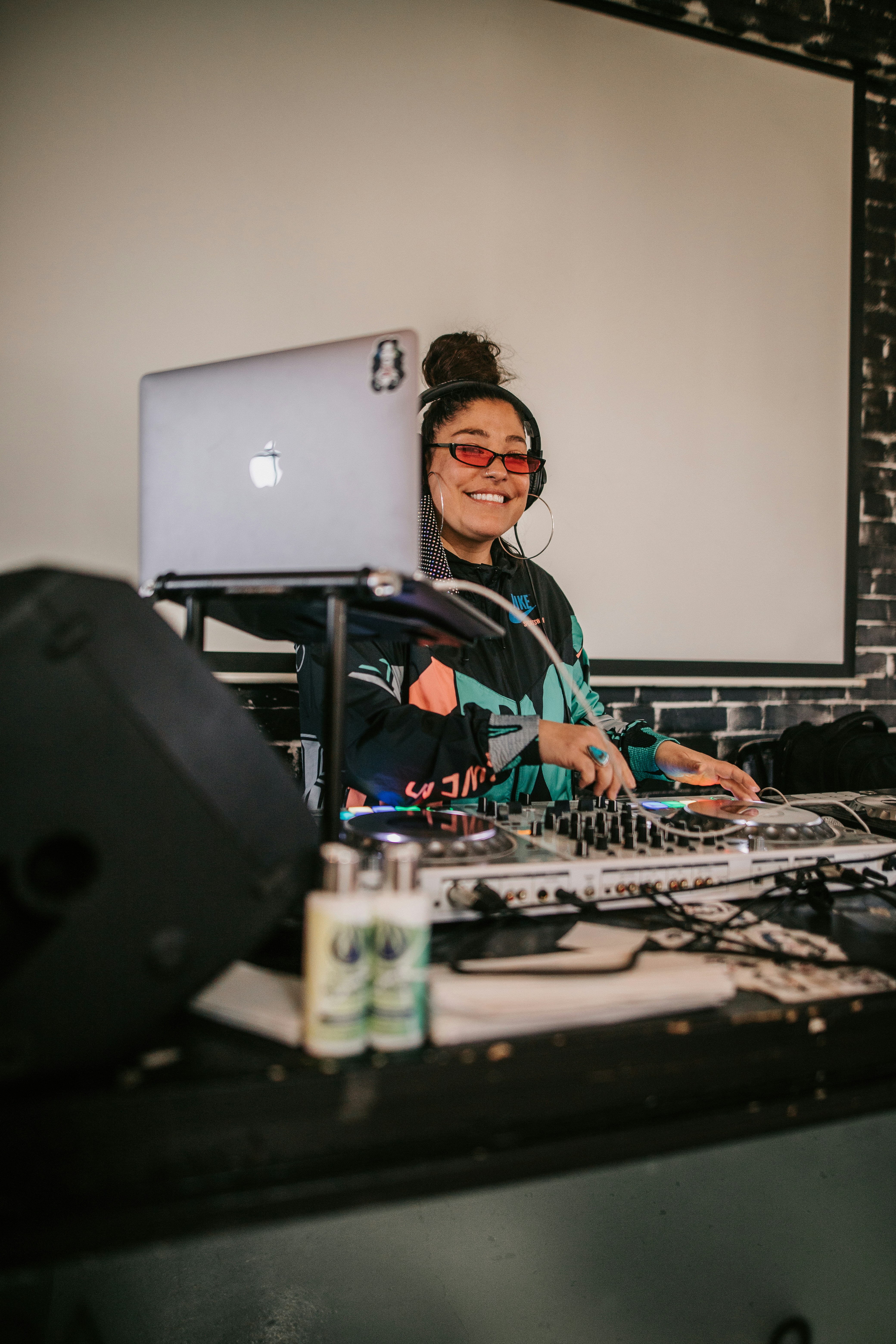 A person sitting at a desk with a computer and a can of soda photo ...
