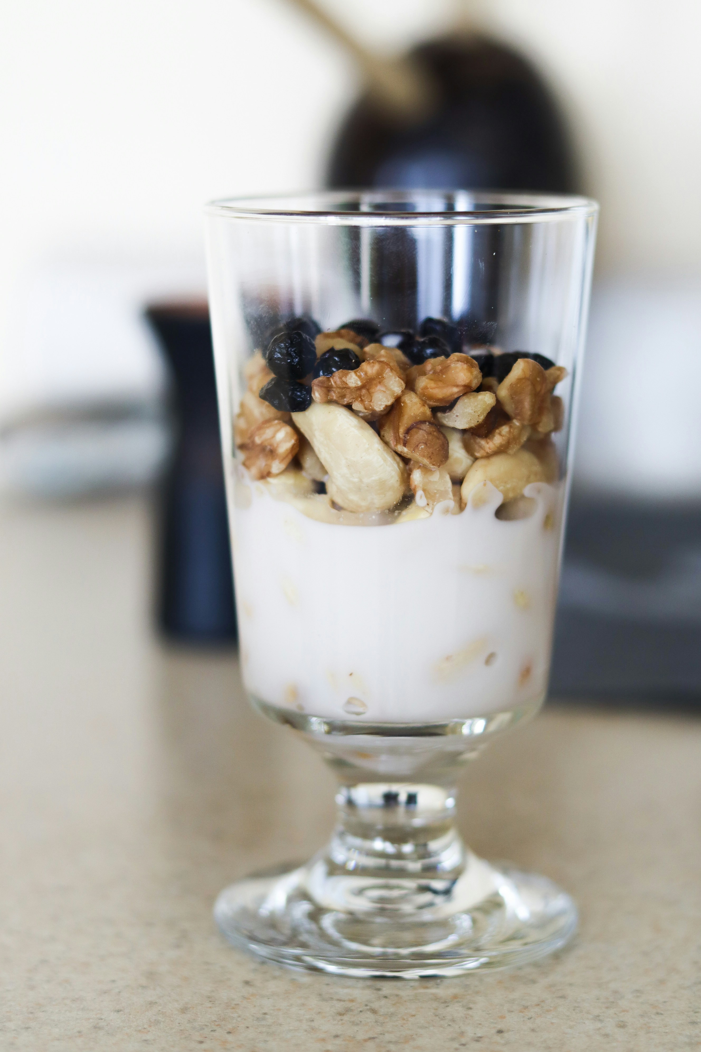 A glass of milk with nuts and chocolate chips photo – Free Plant Image ...