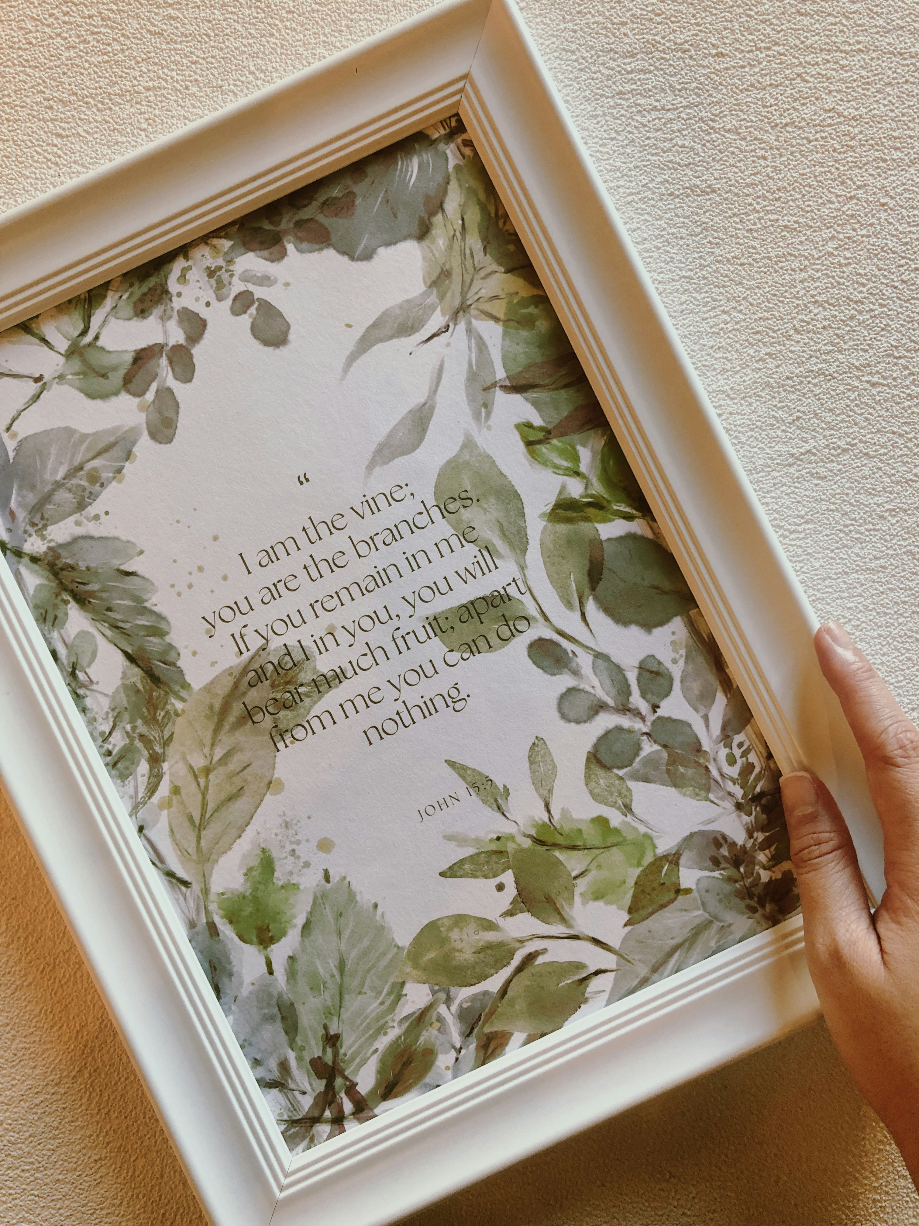 Leafbound Frame: A Gentle Hand Reveals a Botanical Quote
