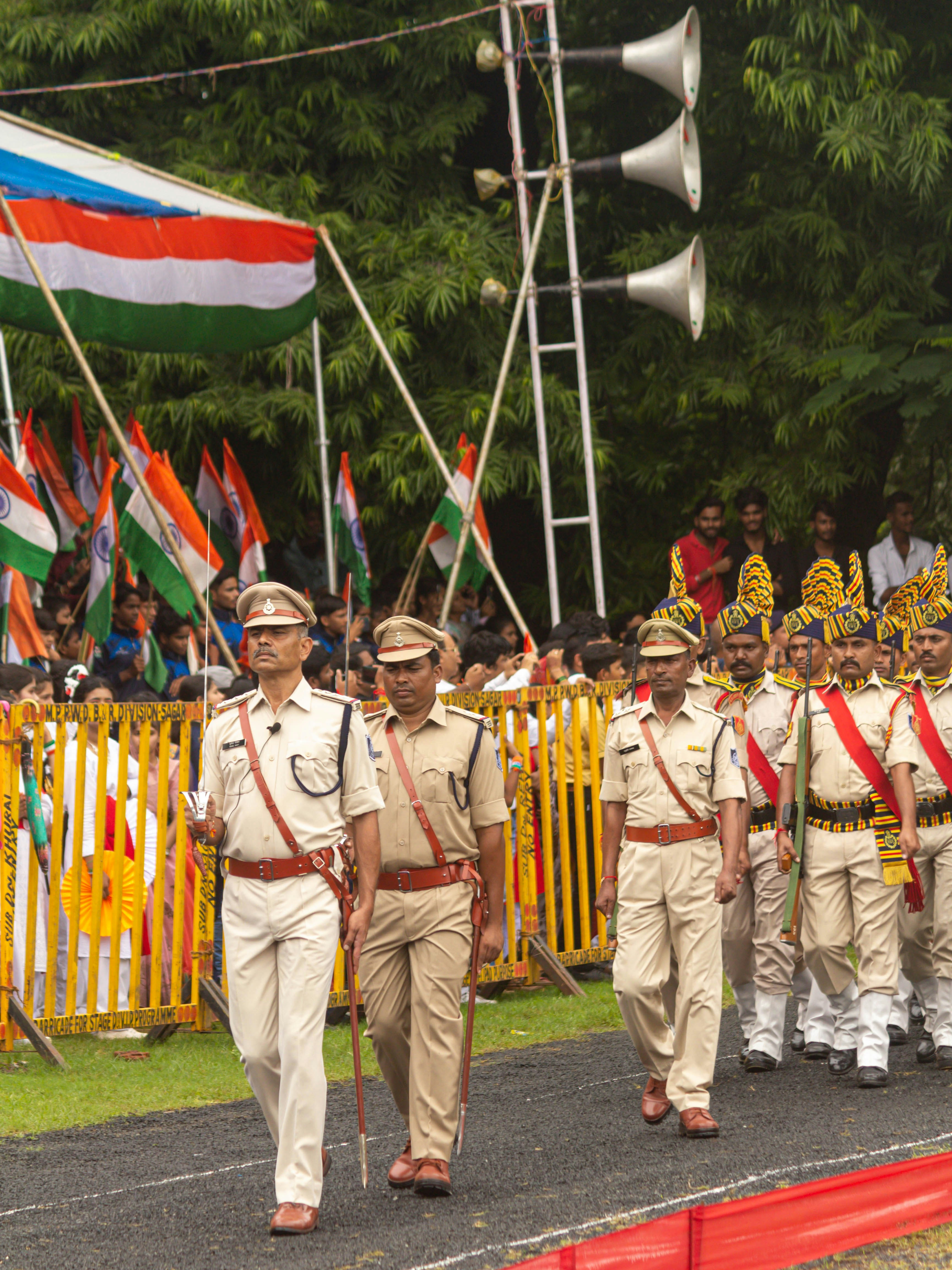 A group of men in military uniforms holding flags photo – Free Sagar ...