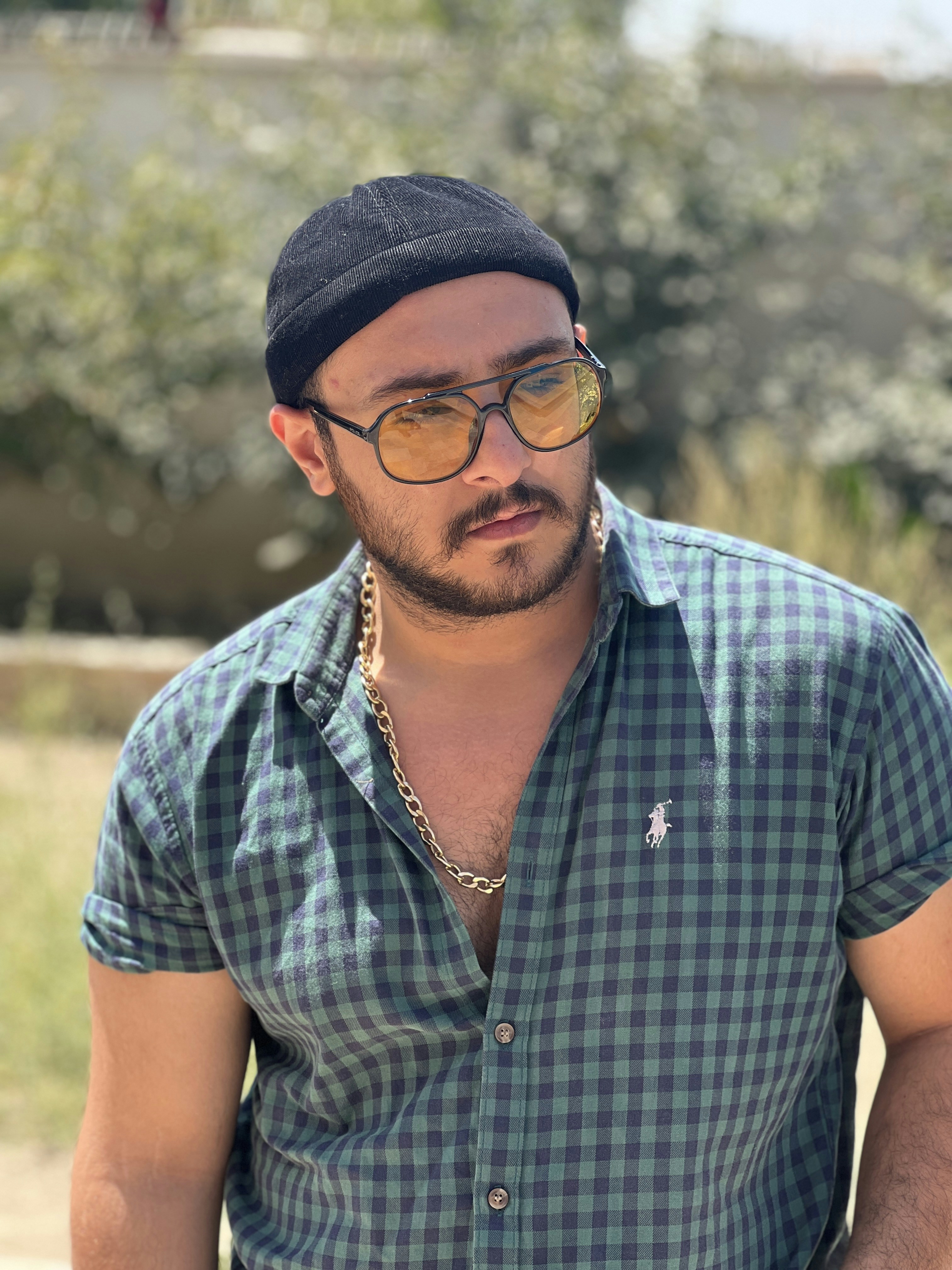 Amber Lenses in Warm Sun: A Quiet Portrait in Plaid