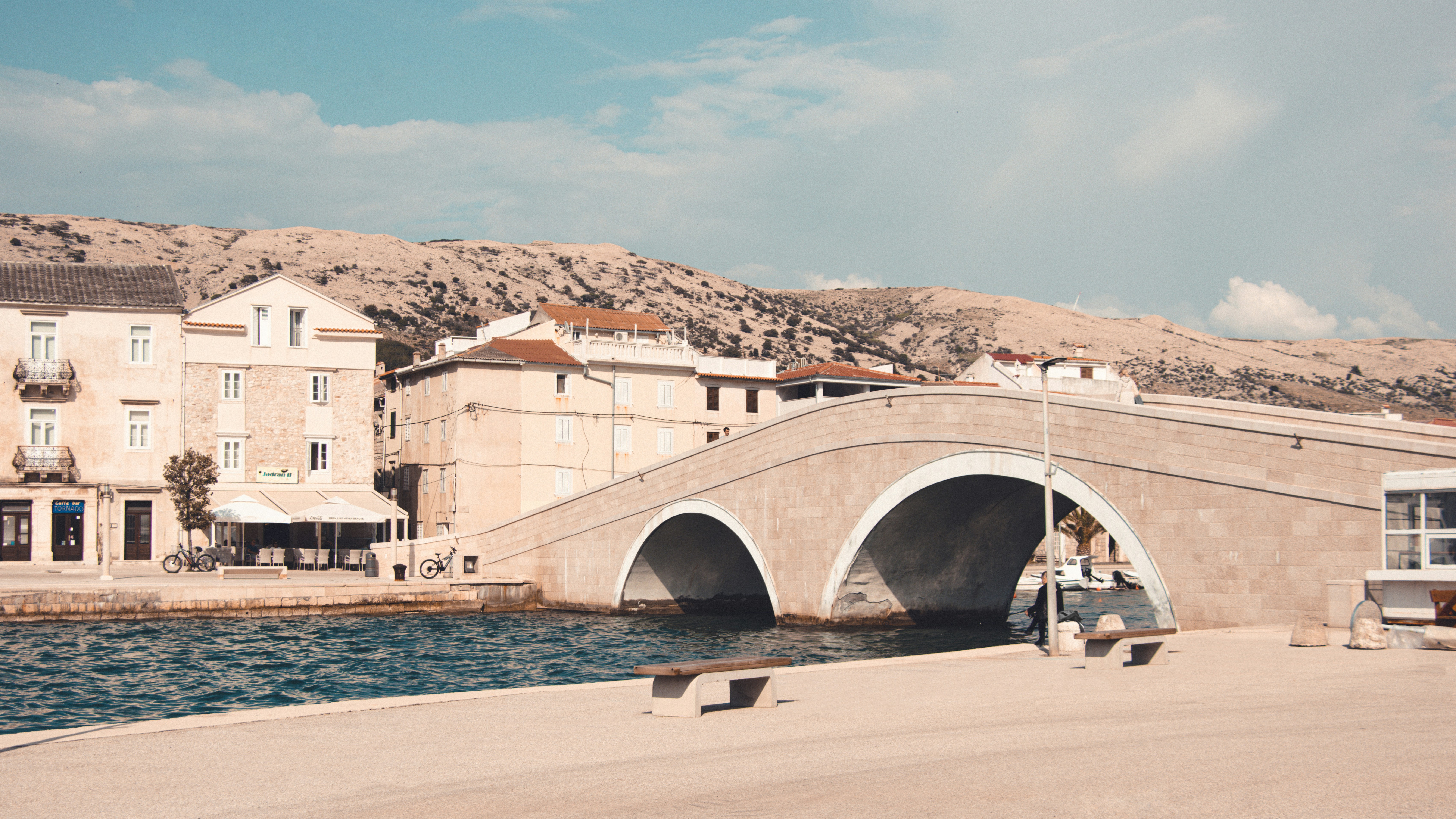 Arched Bridge over a Quiet Adriatic Coastline