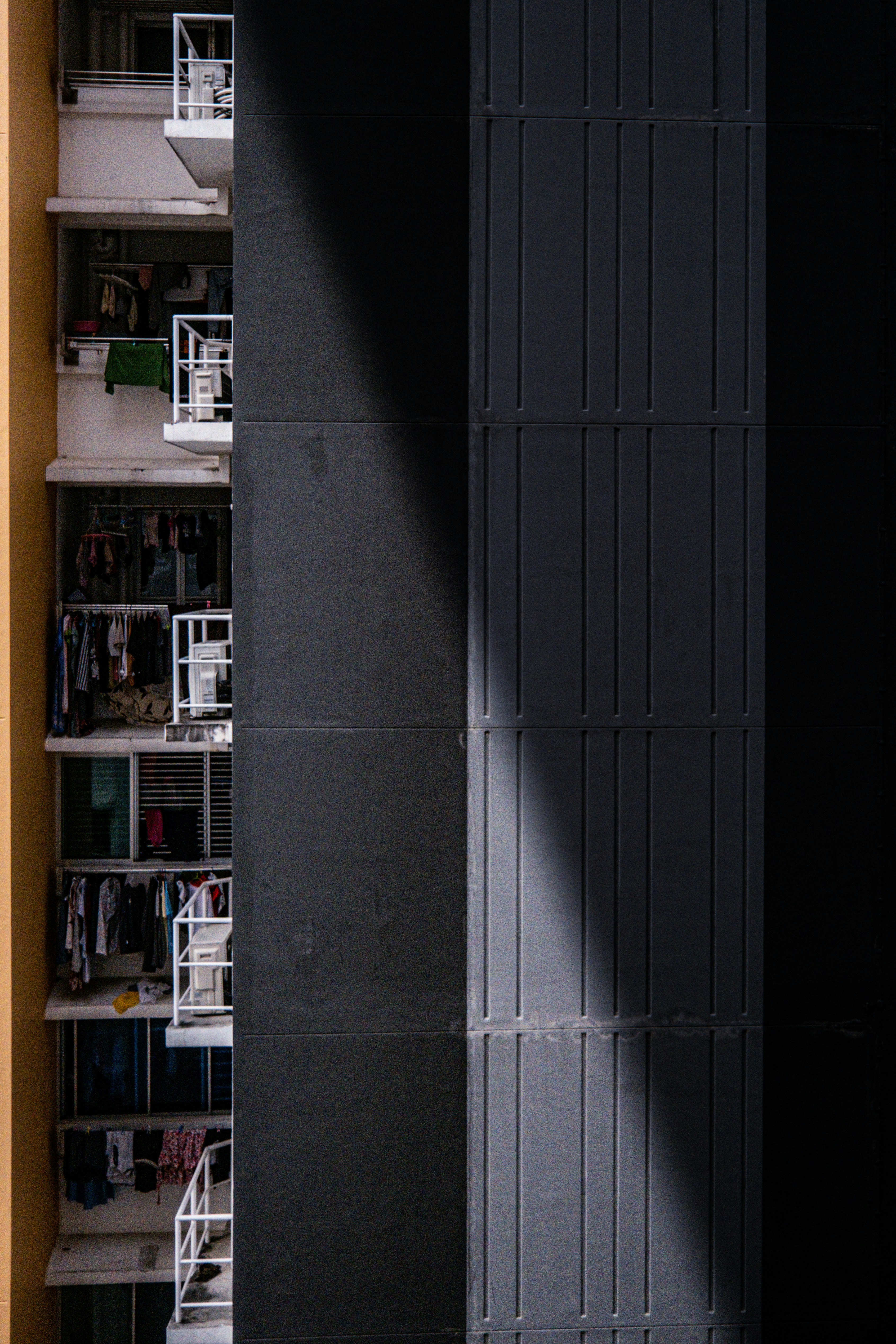 a black rectangular object with shelves and shelves in the background