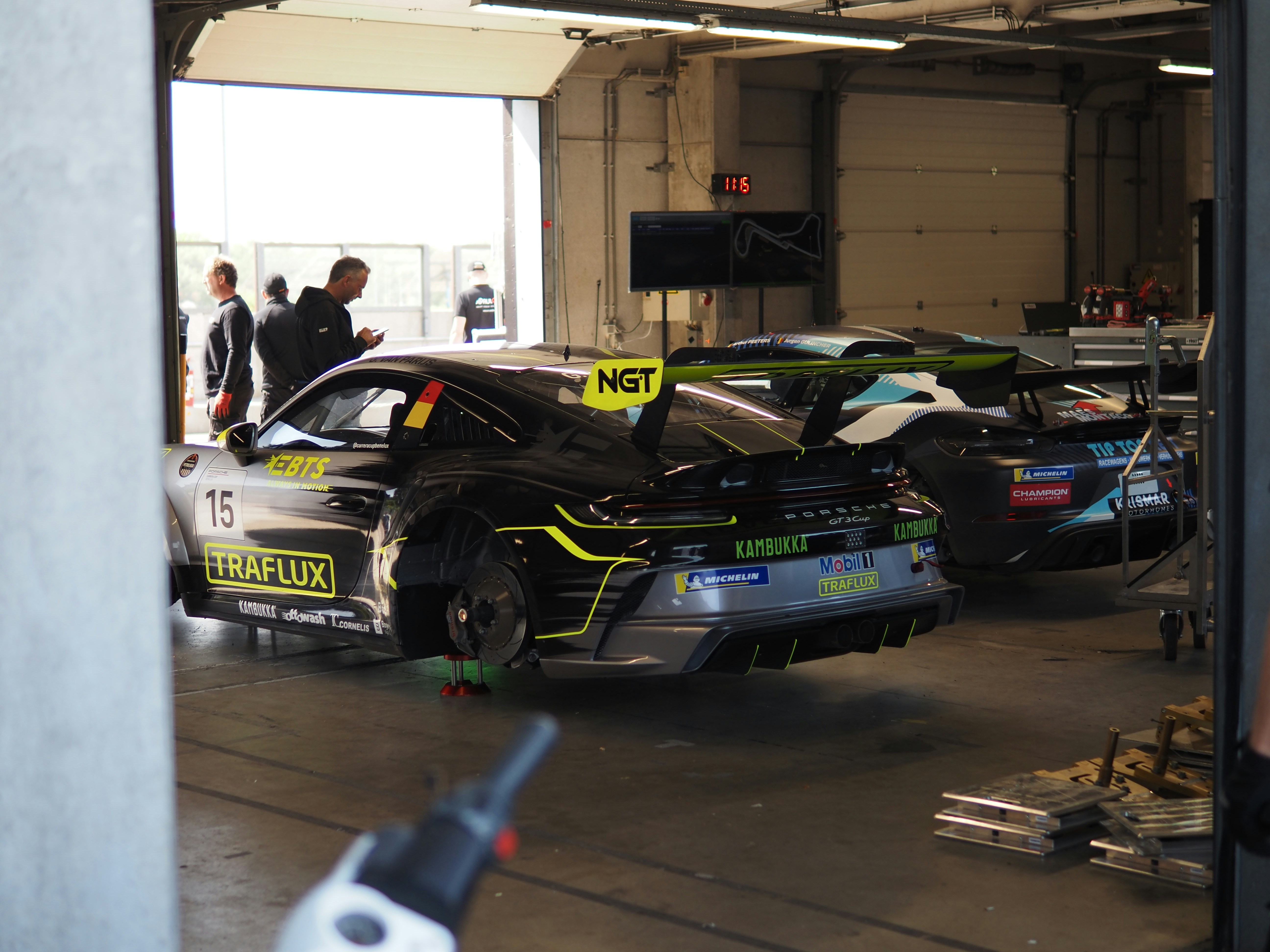 A race car in a garage photo – Free Racing Image on Unsplash