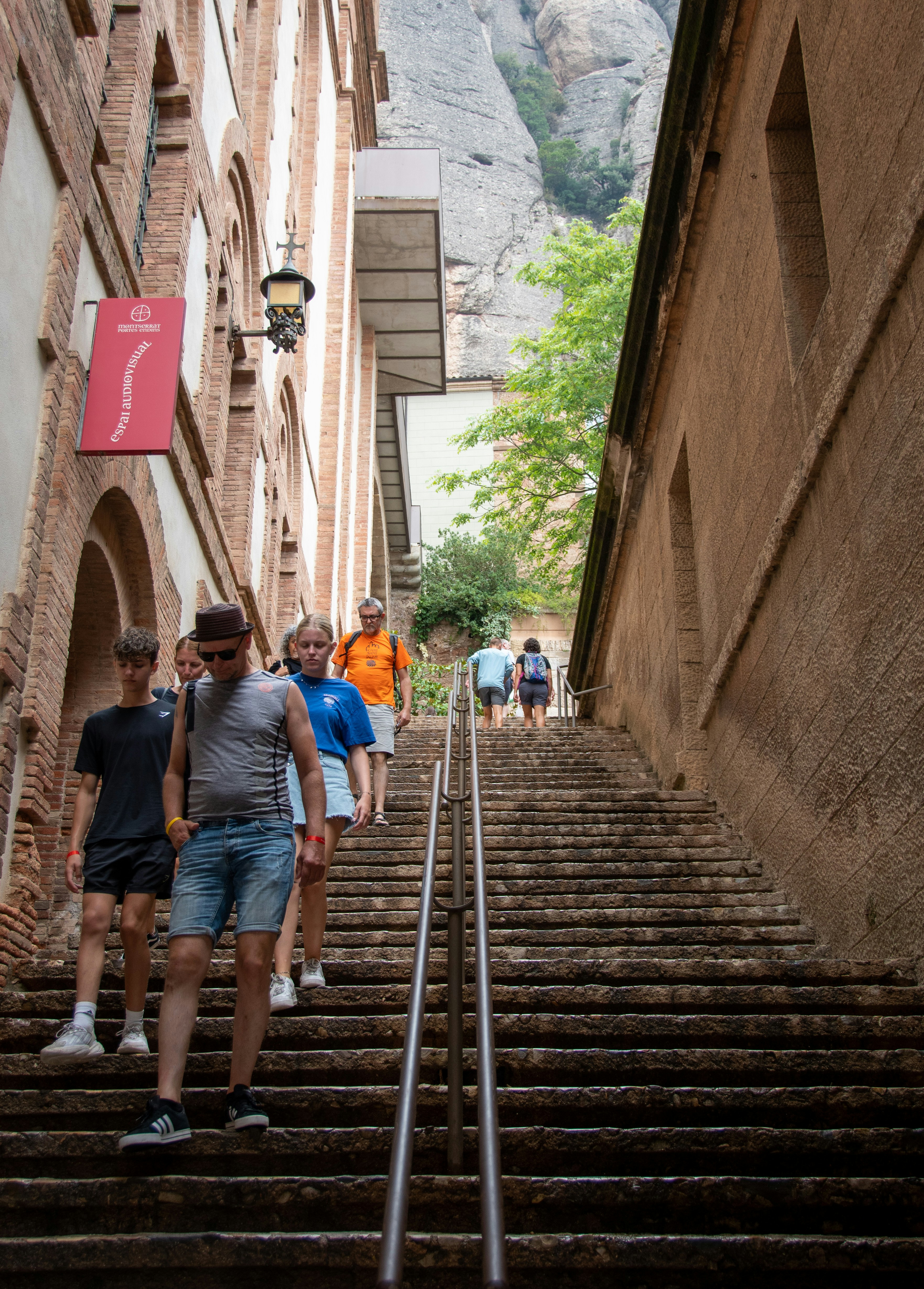 a group of people walking up stairs