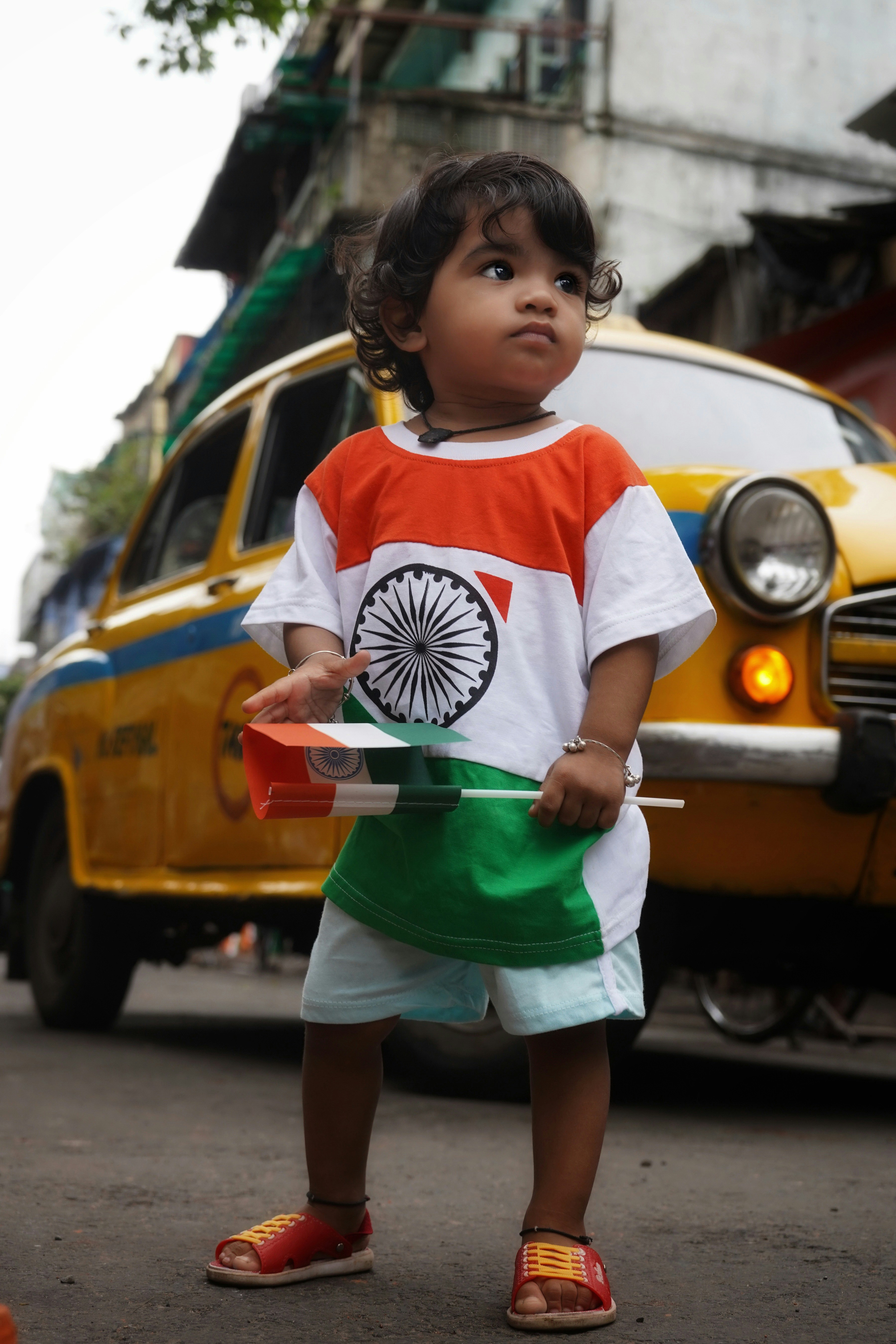 A little boy celebrating 75th Independence Day with taking Indian flag in his hand.