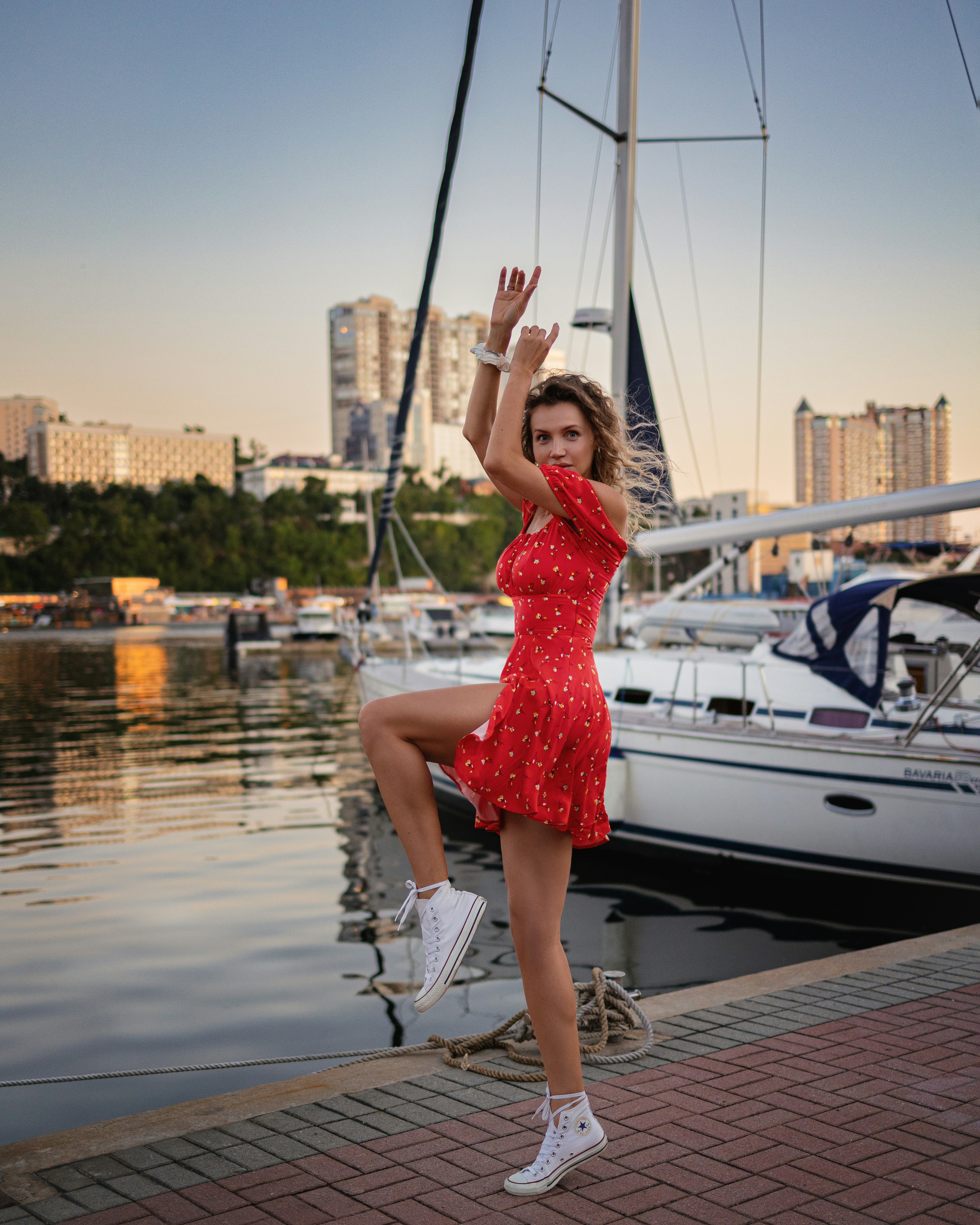 Marina Jazz in Red: A Daring Leap by the Sunset Docks