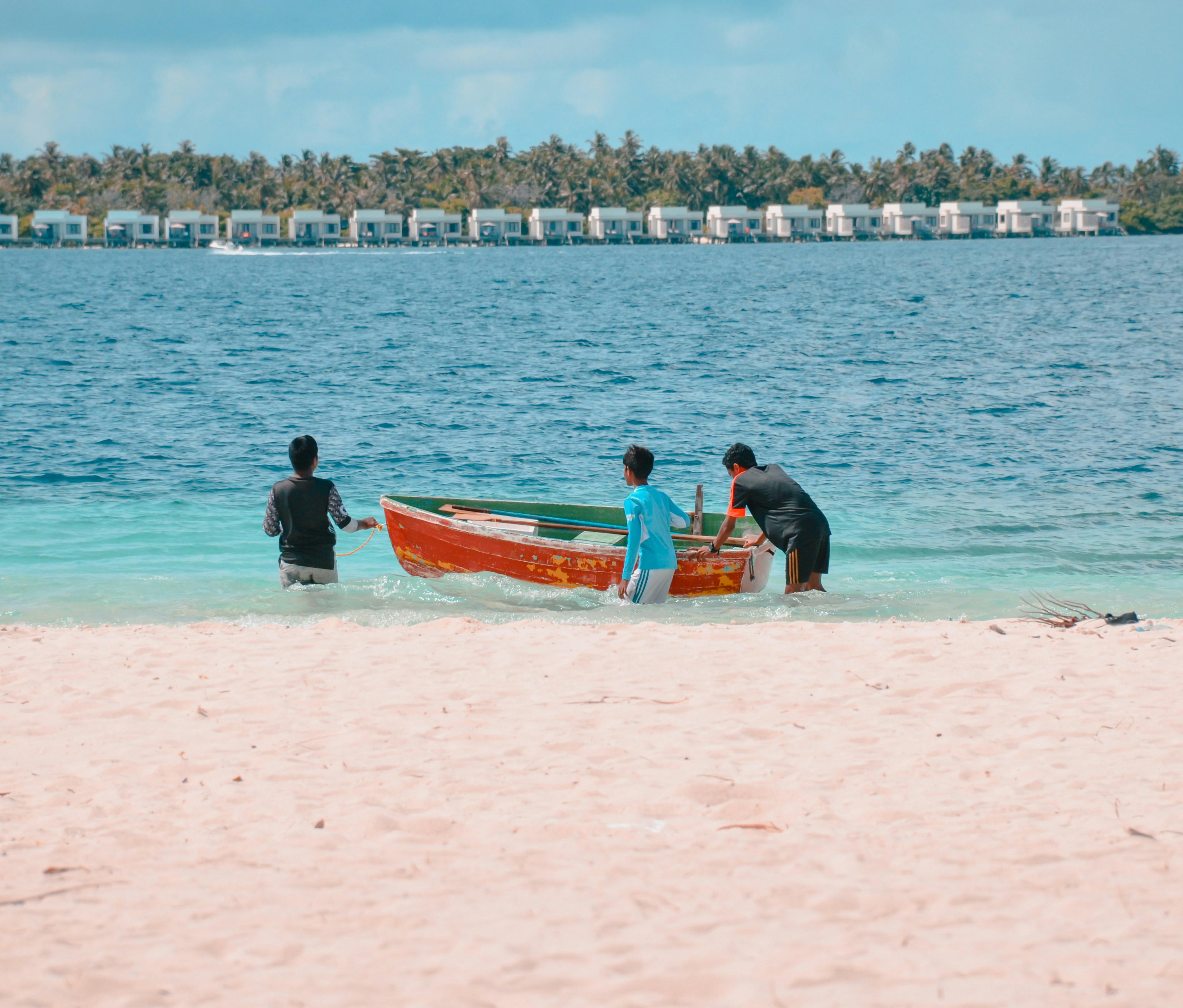 A group of people on a boat in the water photo – Free Meedhoo Image on ...