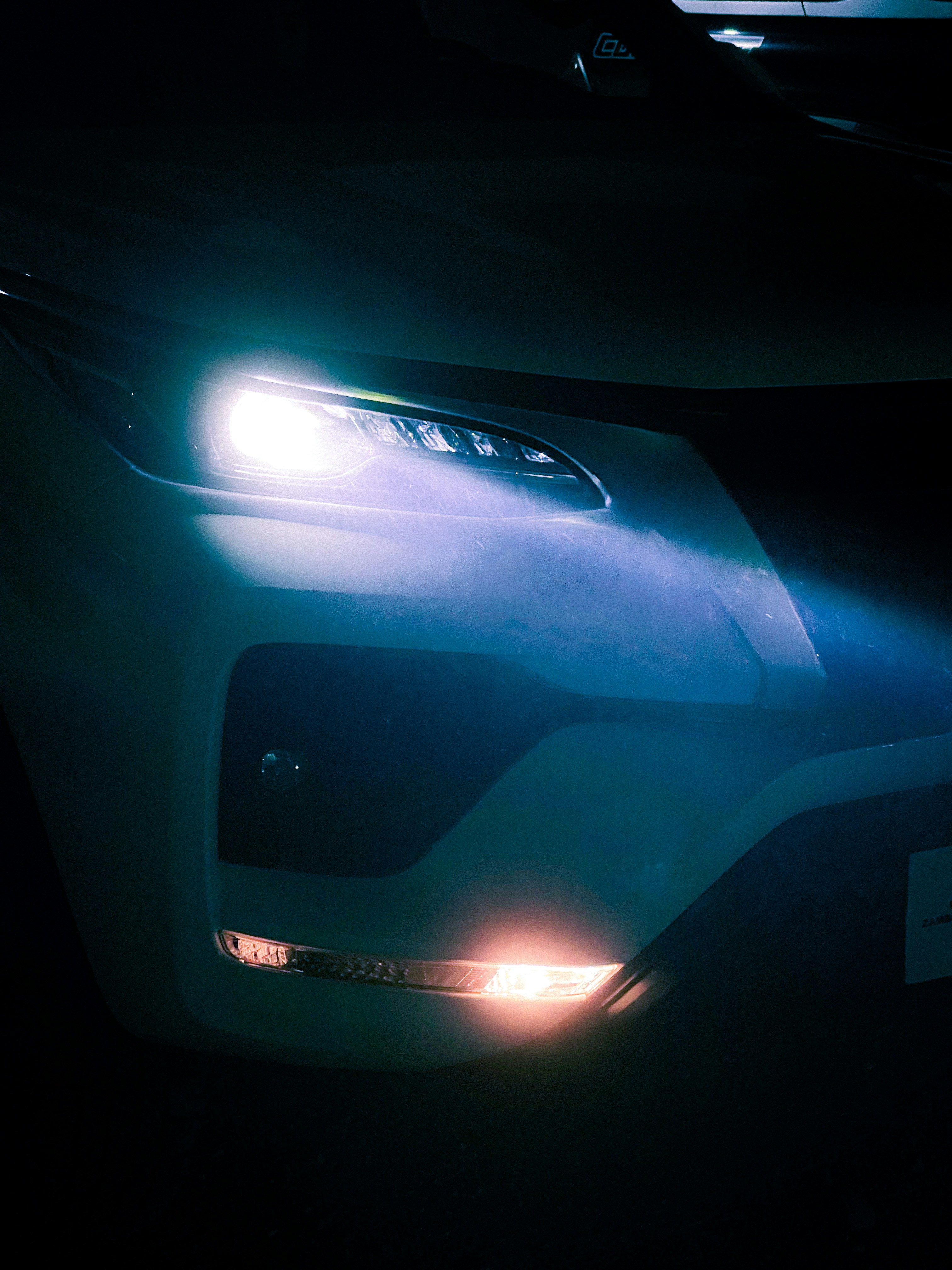 A car with its headlights on photo – Free Headlight Image on Unsplash