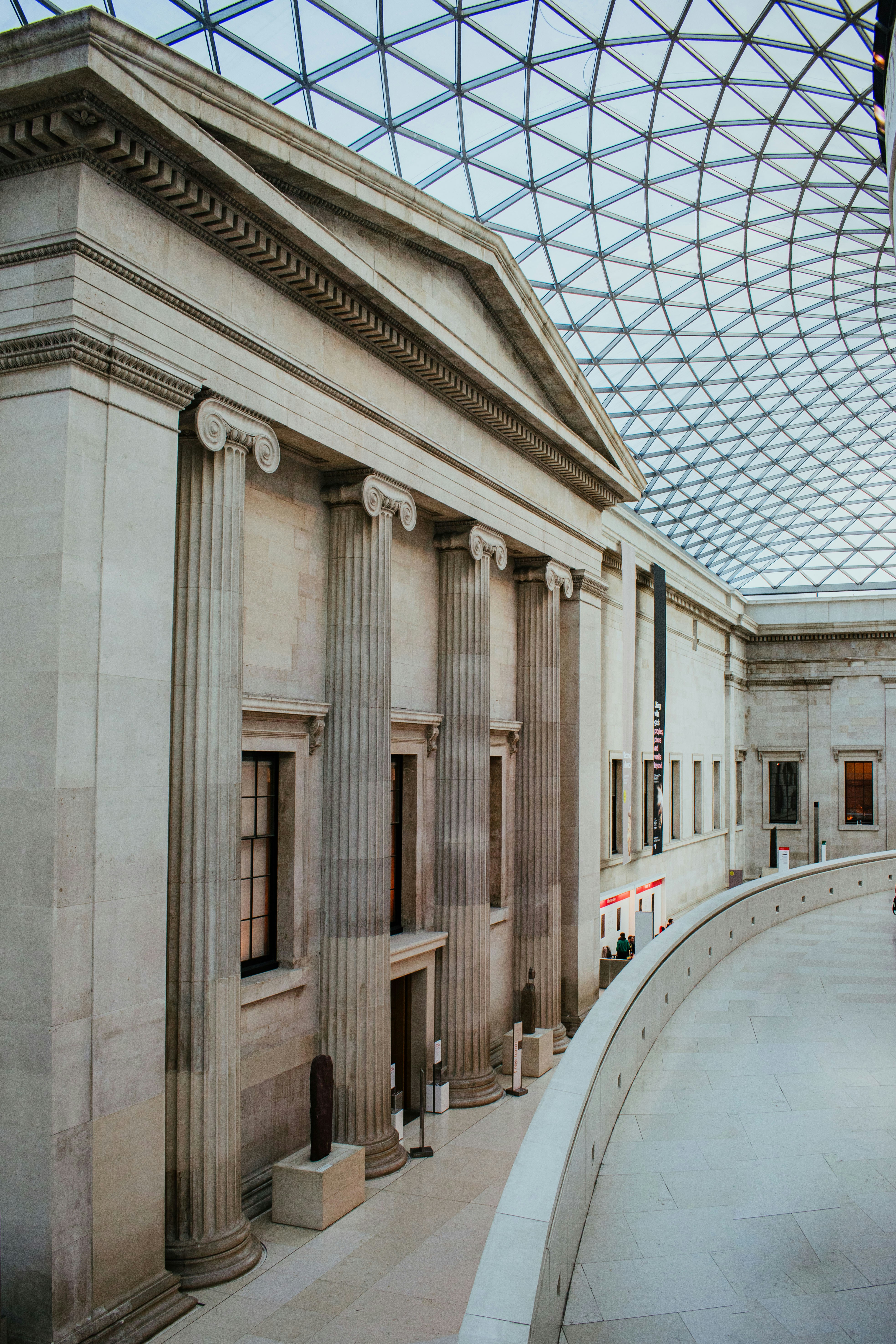 Pillared Grandeur Under Glass: A Classical Hall Enclosed in a Glass Atrium