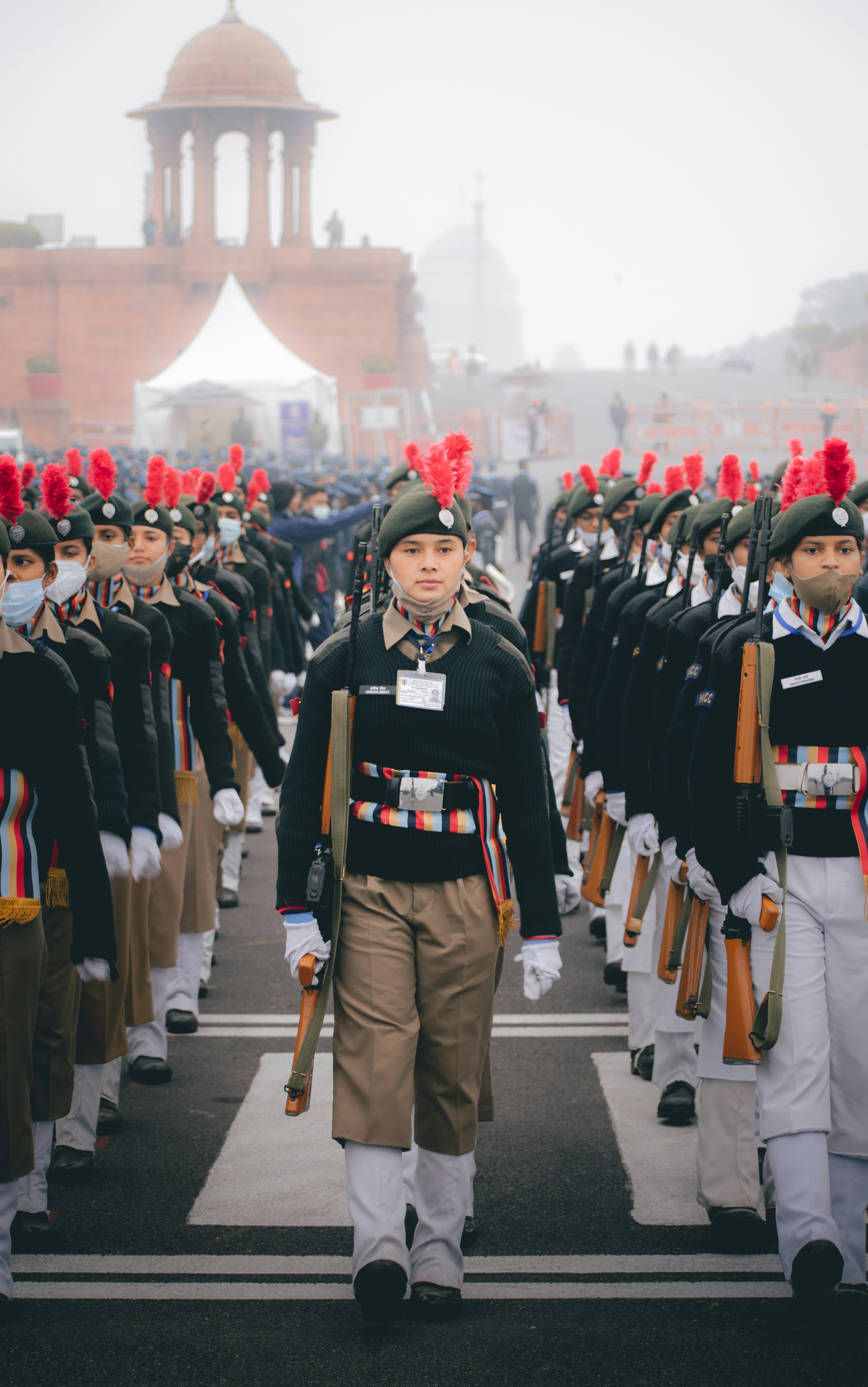 A group of people in uniform marching photo – Free Person Image on Unsplash