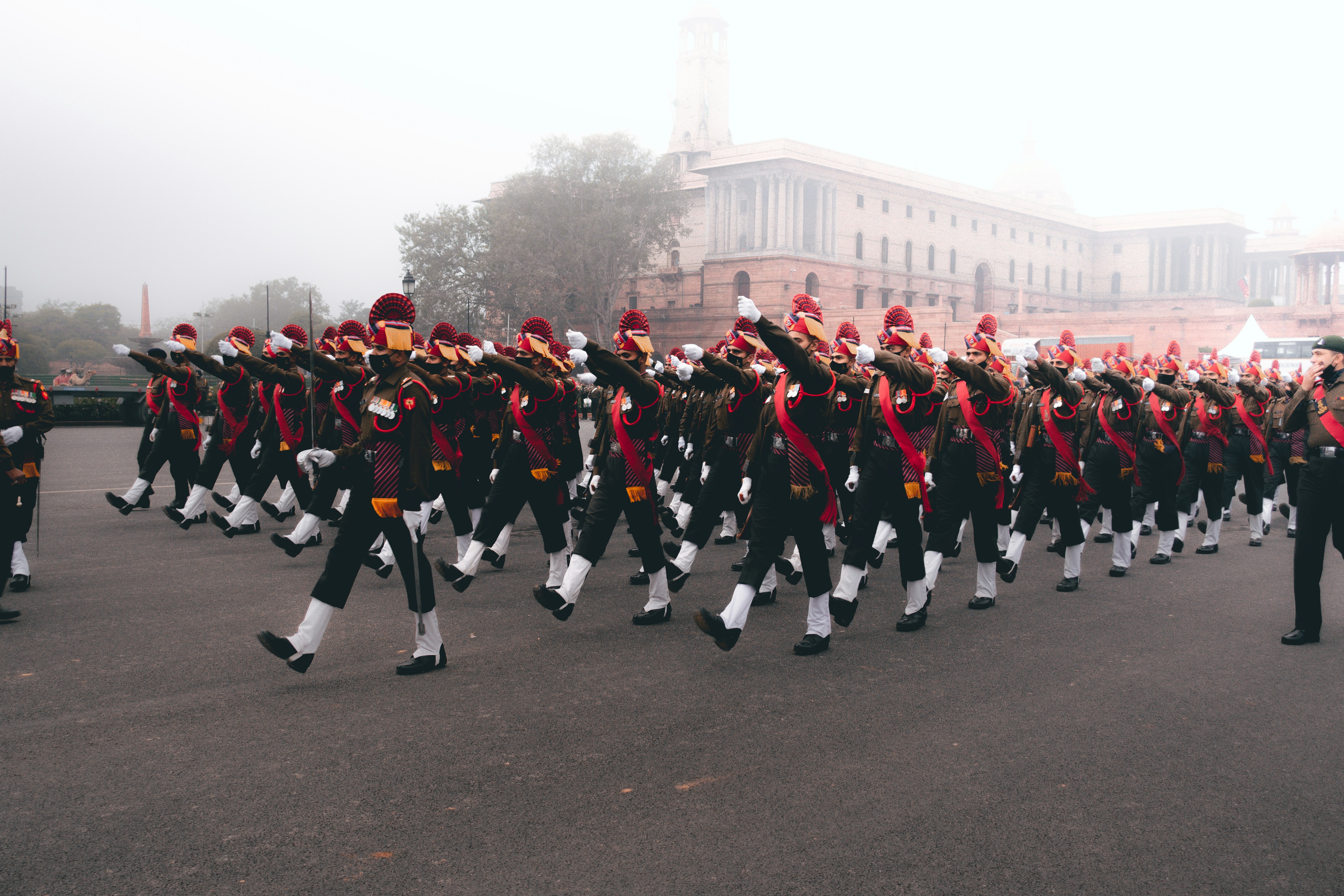 A group of people in uniform marching photo – Free Human Image on Unsplash