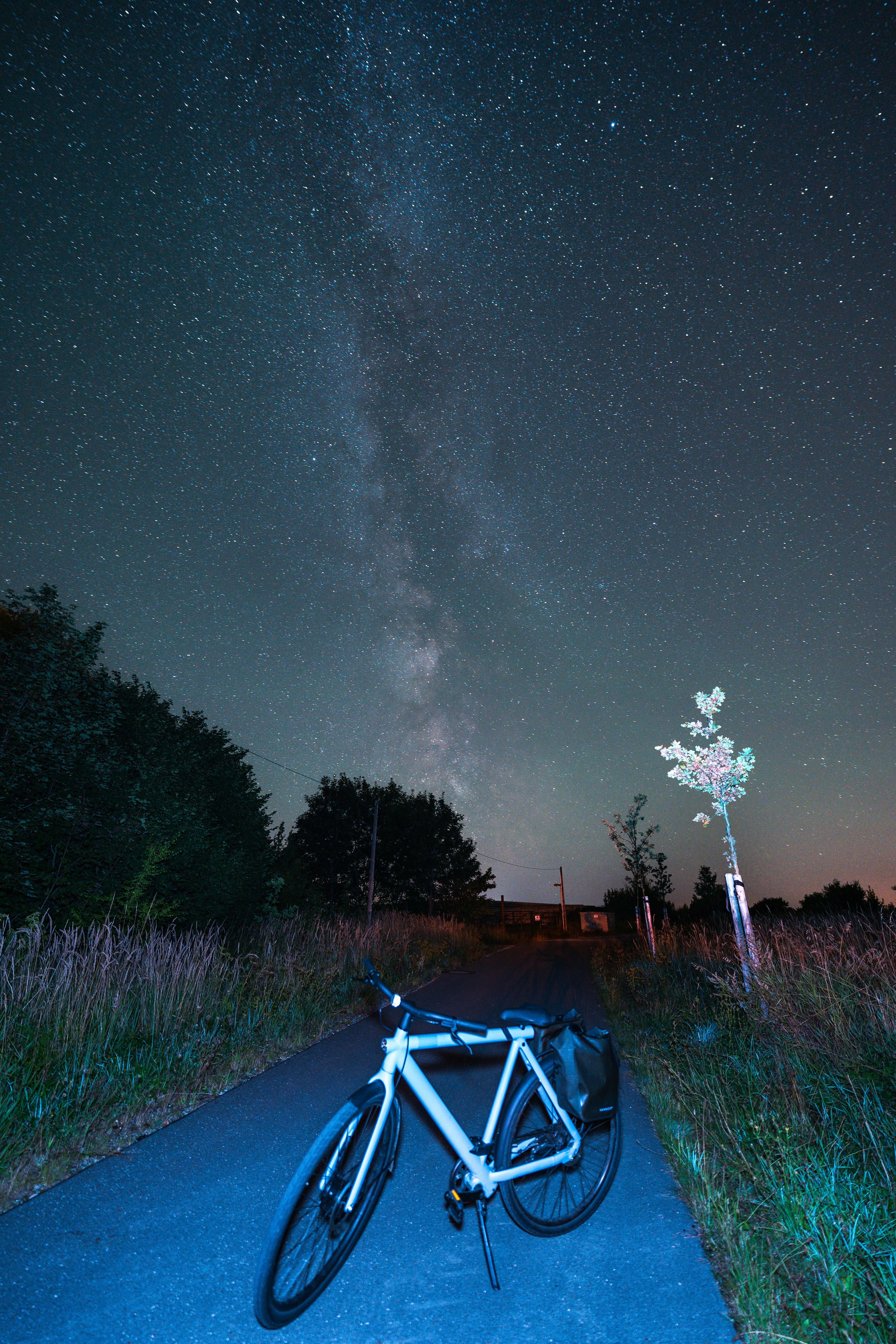 Milky Way Over the Quiet Road with a Bike