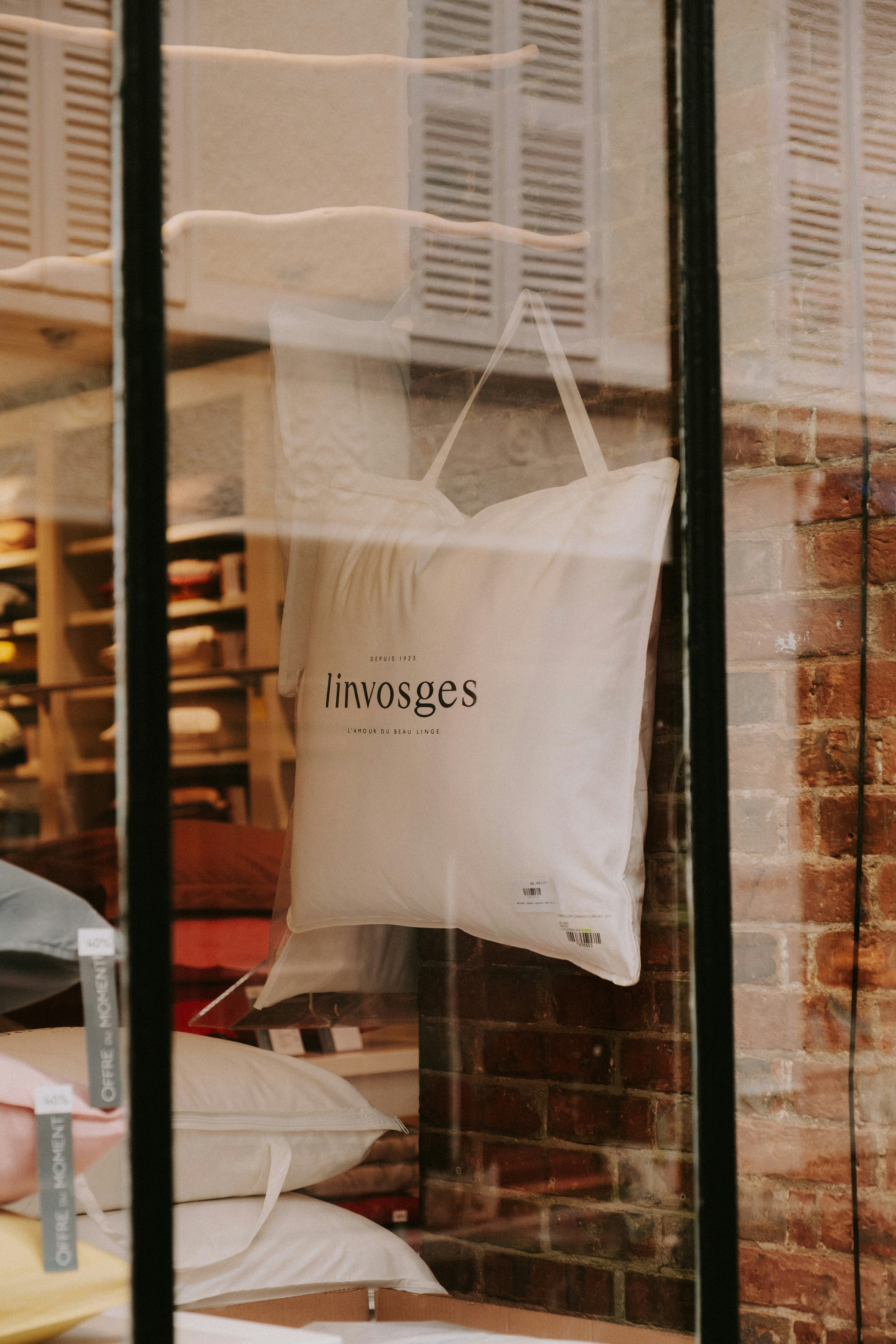 Hanging Linen Bag in a Brick-Cored Window Display