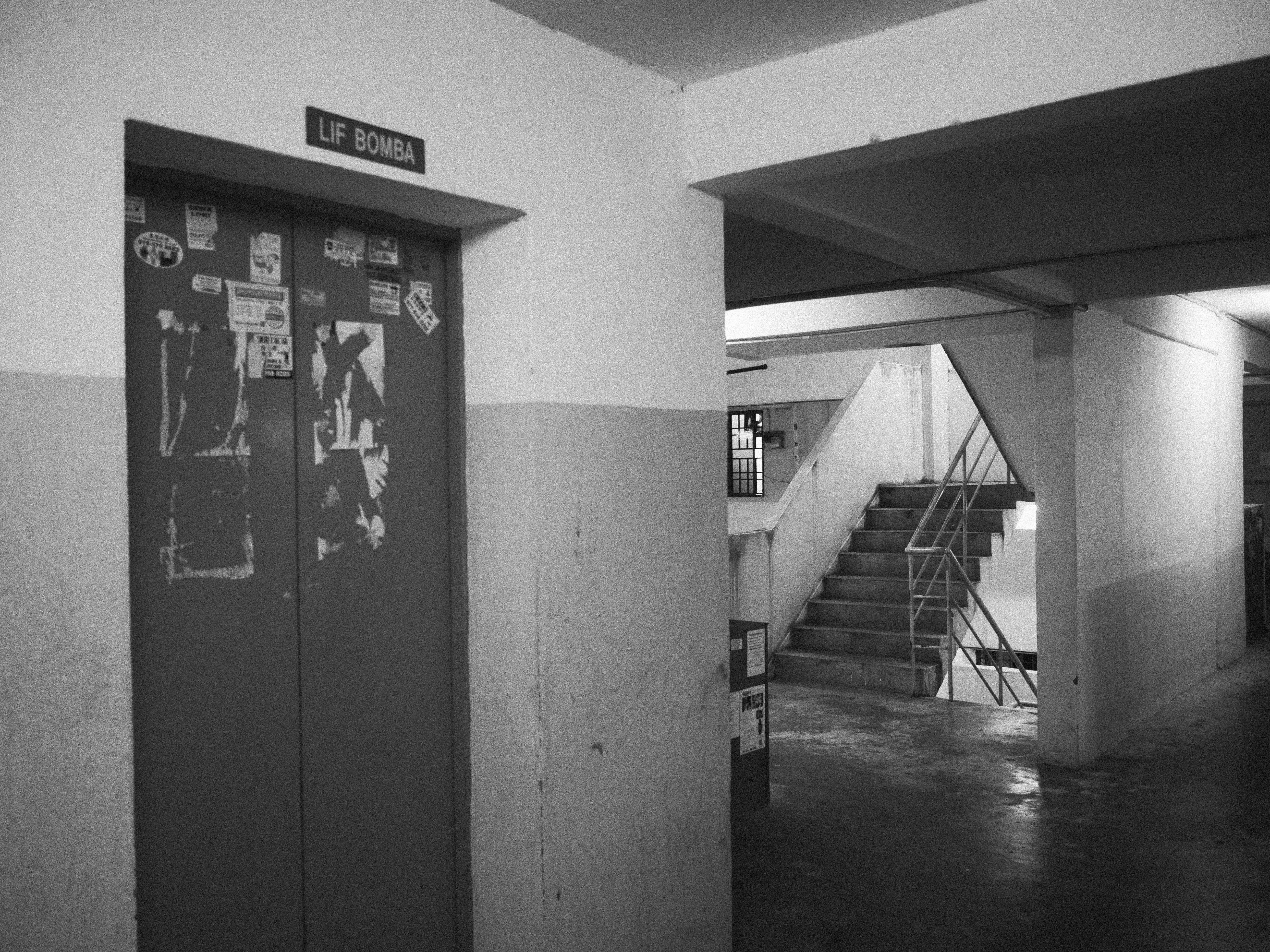 Concrete Confluence: Dim Underground Stairwell
