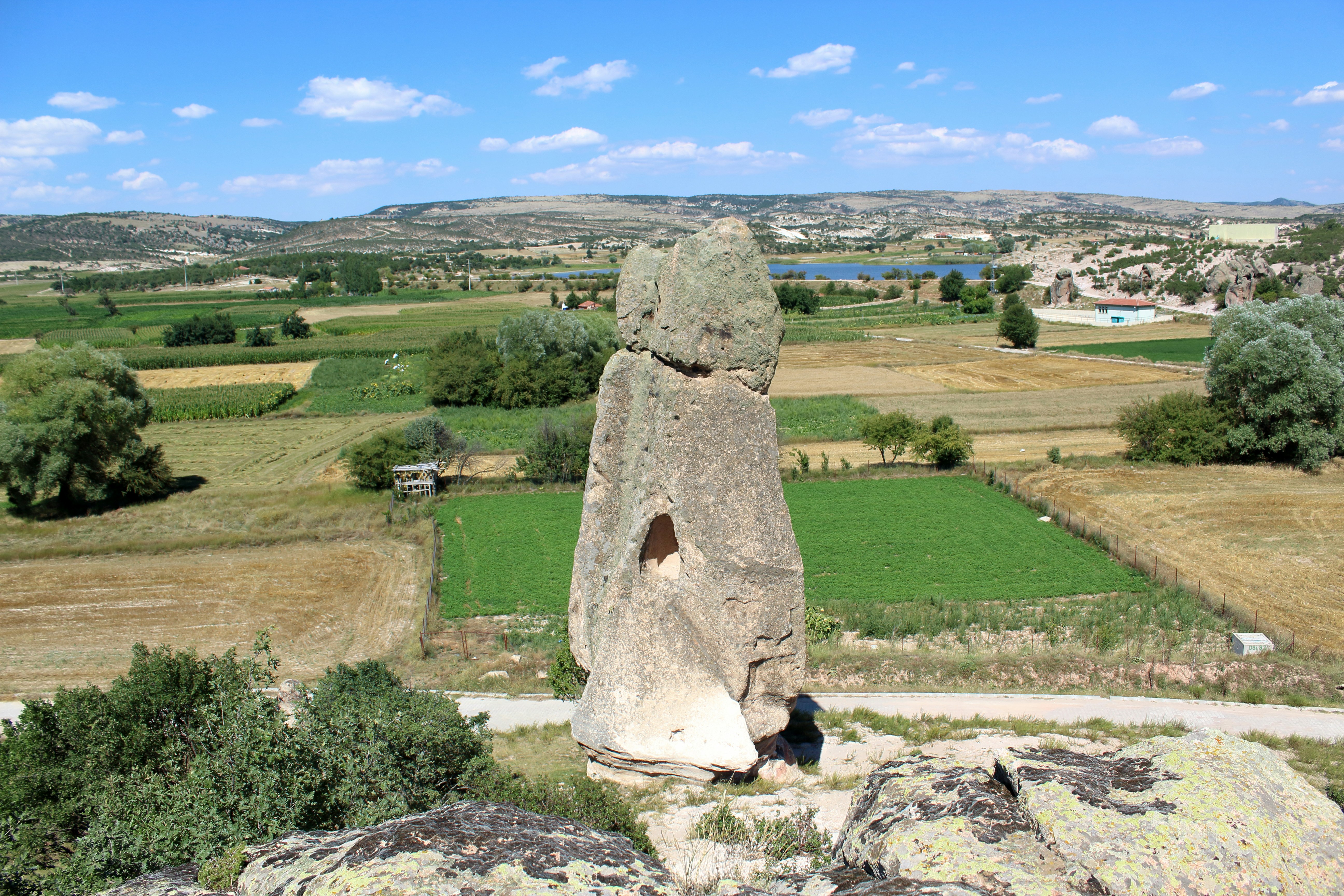 A stone statue on a hill photo – Free Rock formations Image on Unsplash